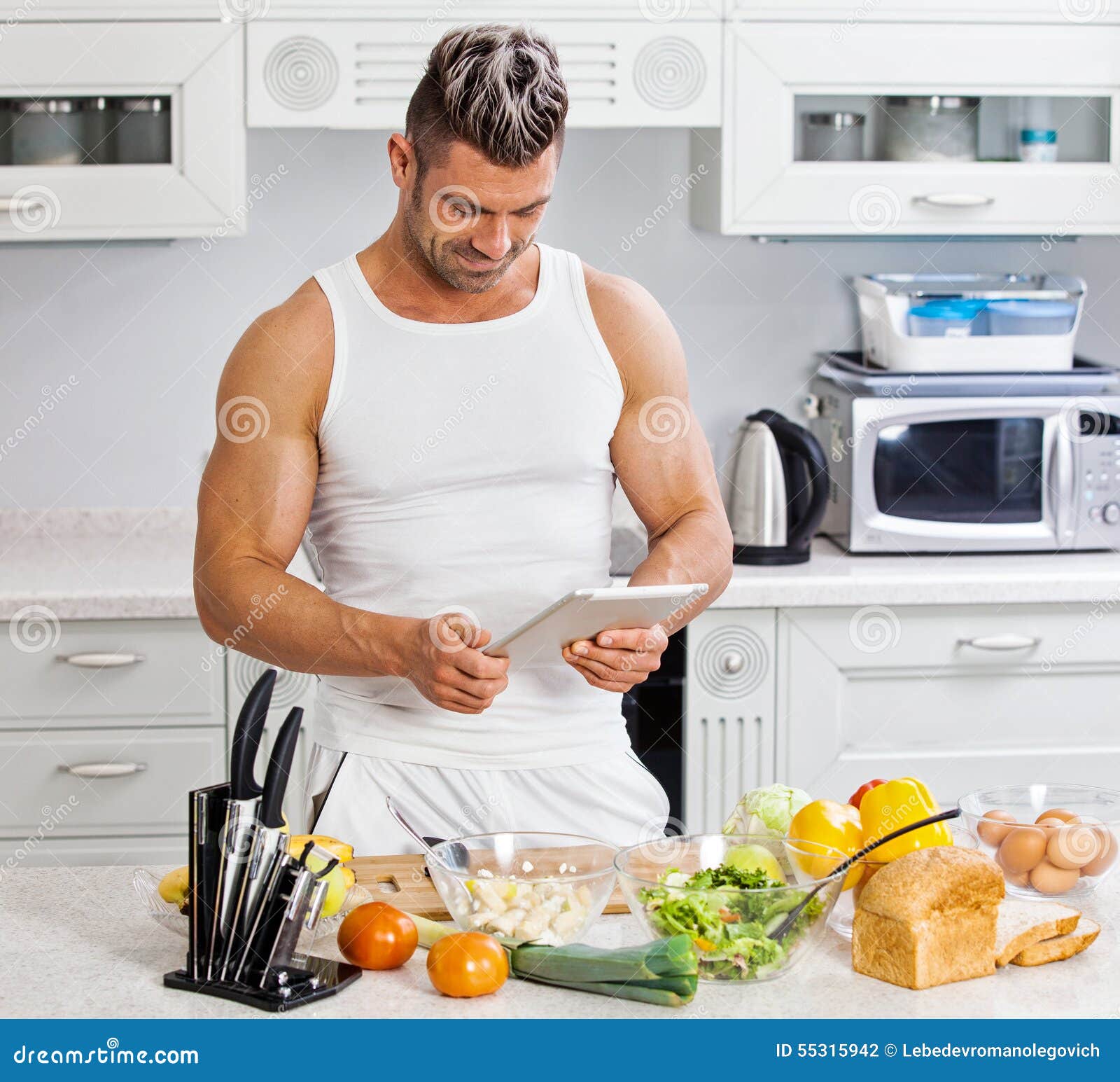 Happy Handsome Man Cooking in Kitchen at Home. Stock Photo - Image of ...