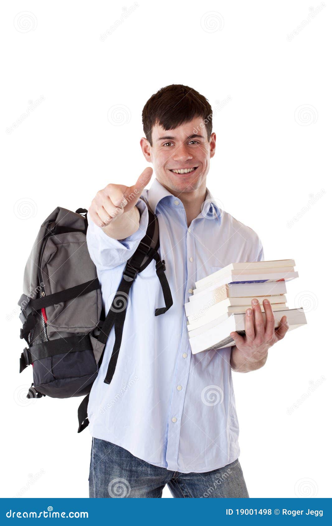 Handsome Student Reading A Book For His Class In A Bright Modern ...