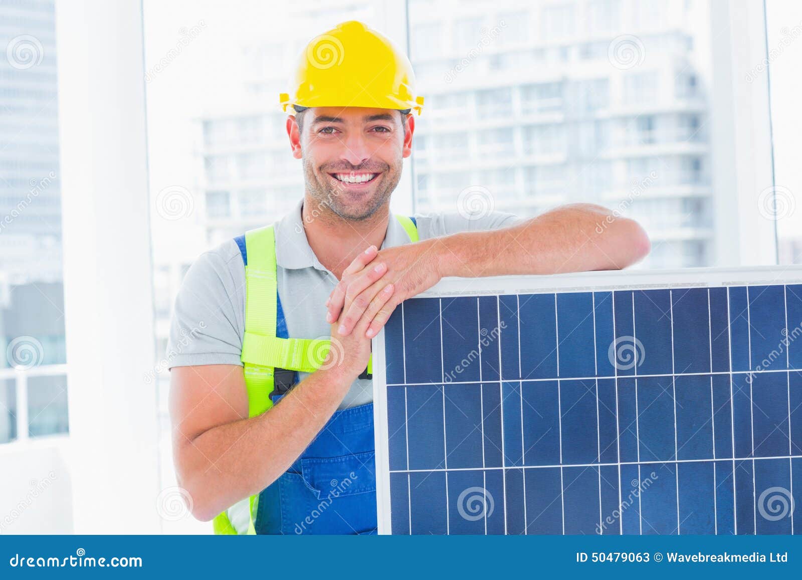 Happy Handyman with Solar Panel in Bright Office Stock Image - Image of ...