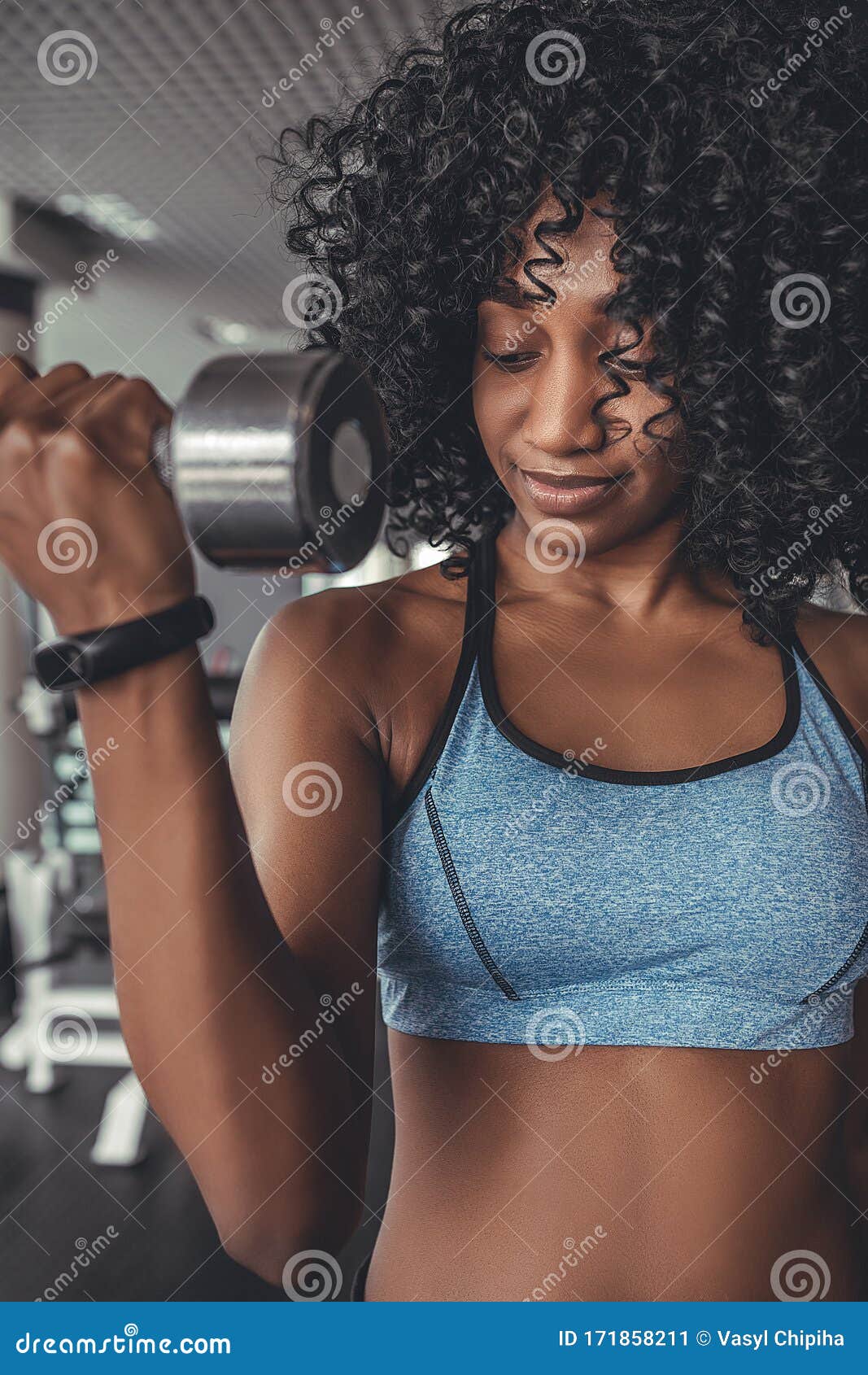 Happy Healthy Young African American Woman Working Out In A Gym With A