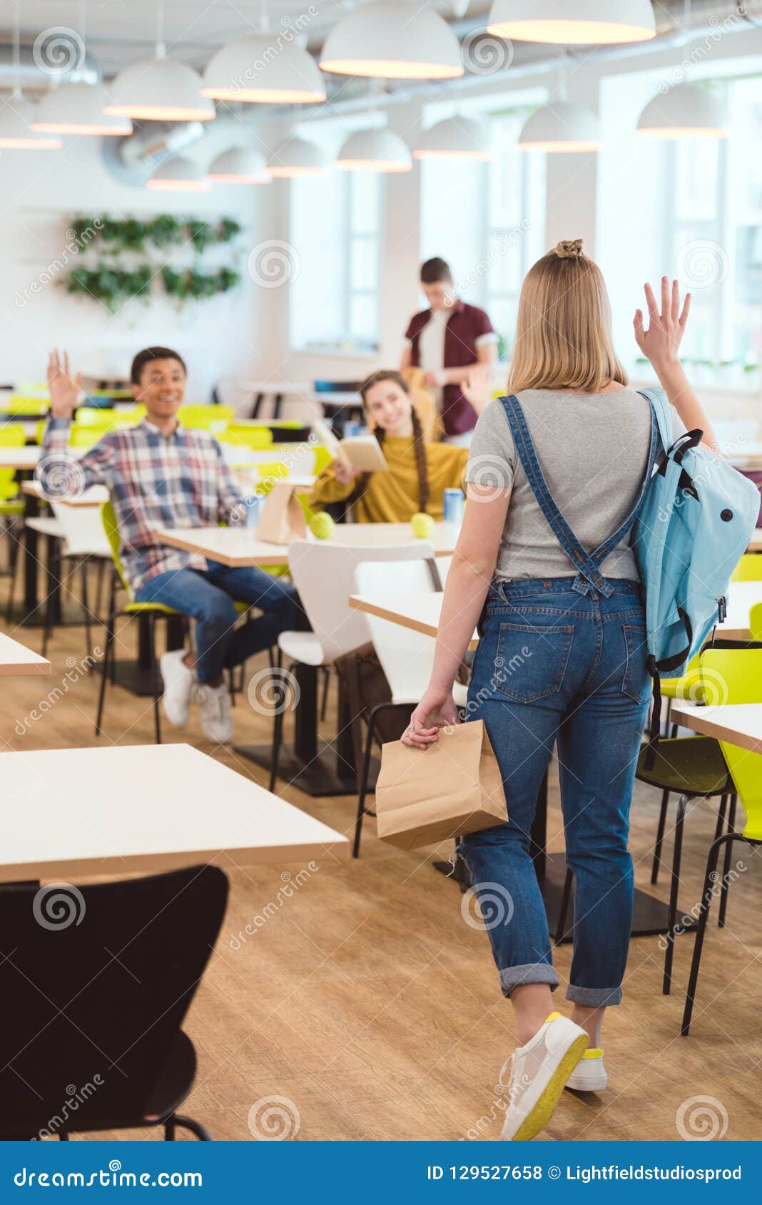 Happy High School Students Greeting Their Classmate Stock Photo - Image ...