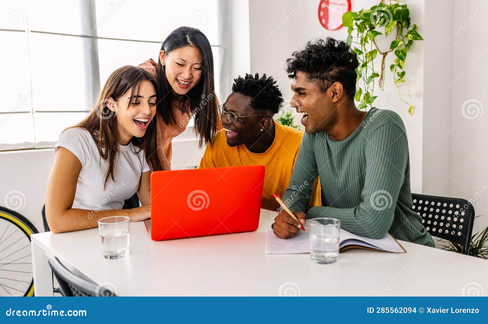 Happy High School Students Learning Together Using Laptop Computer at ...