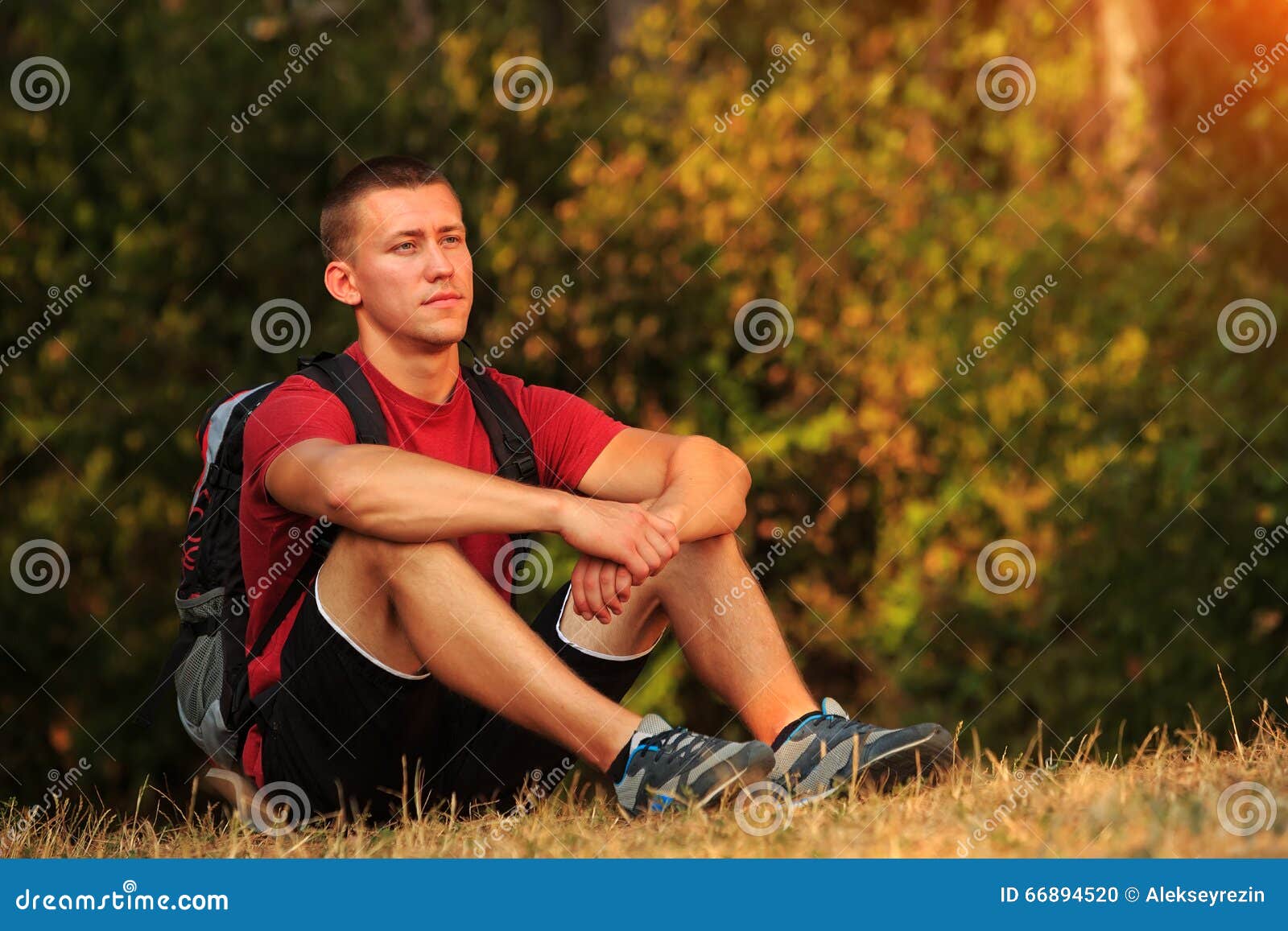 Happy Hiker Man Sitting on the Ground and Looking Forward Stock Photo ...