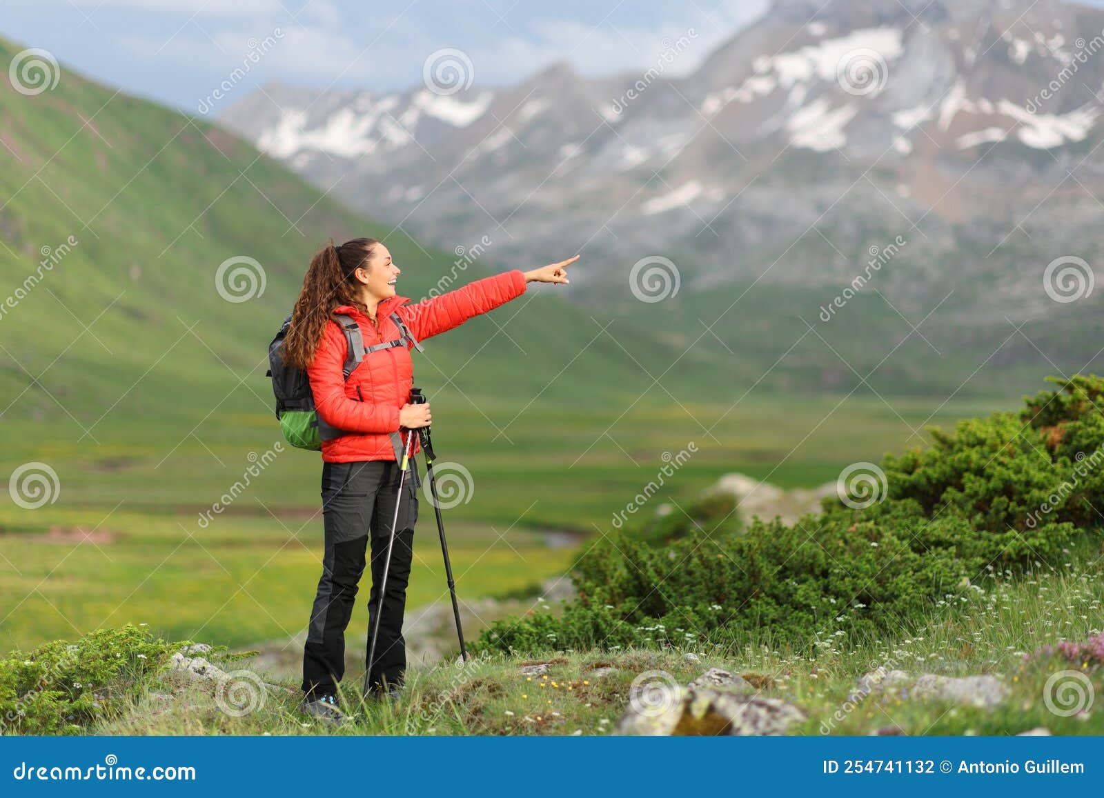 Happy Hiker Pointing Away in the Mountain Stock Photo - Image of ...