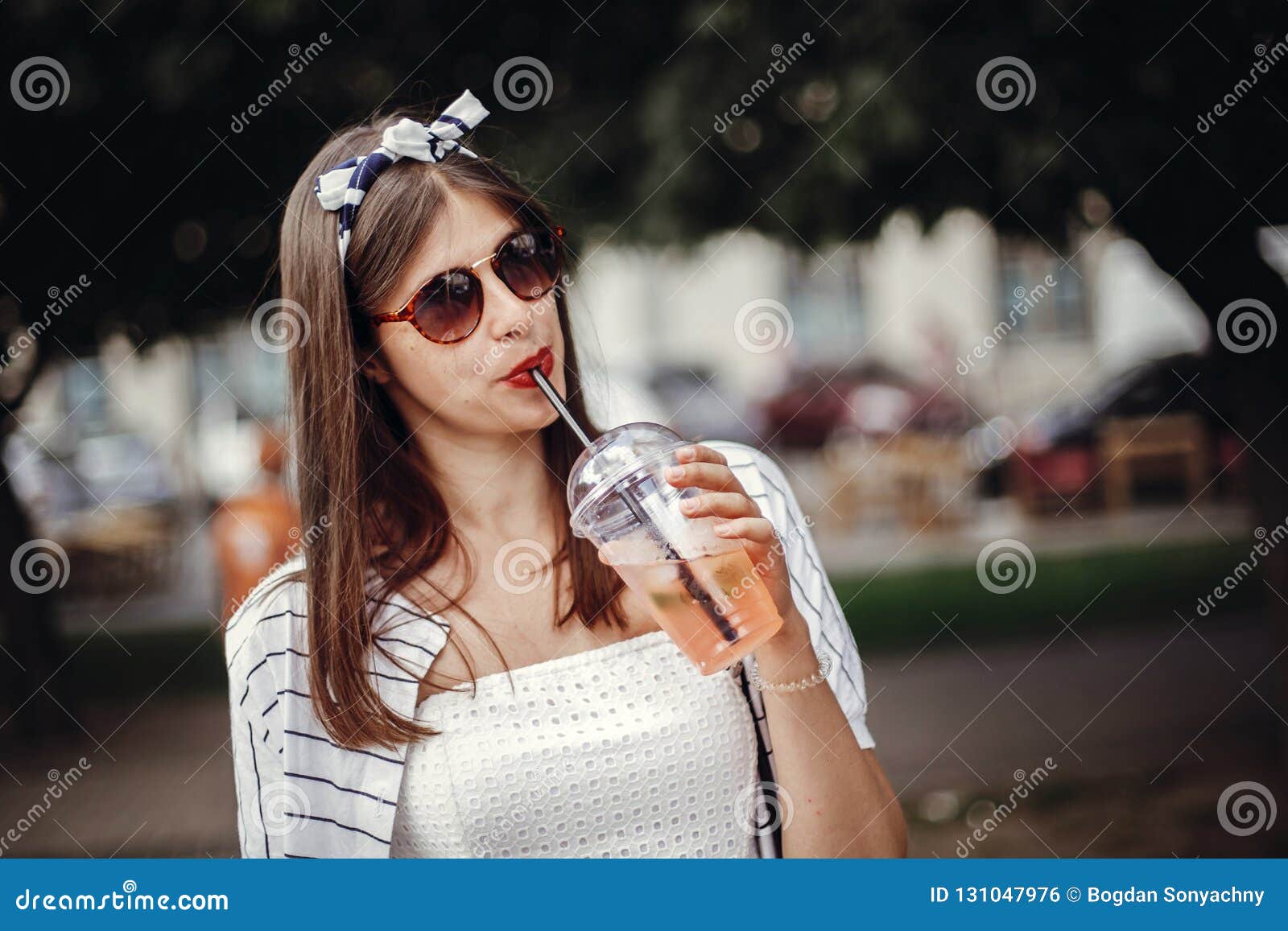 Happy Hipster Girl With Sunglasses In Retro Dress And Headband