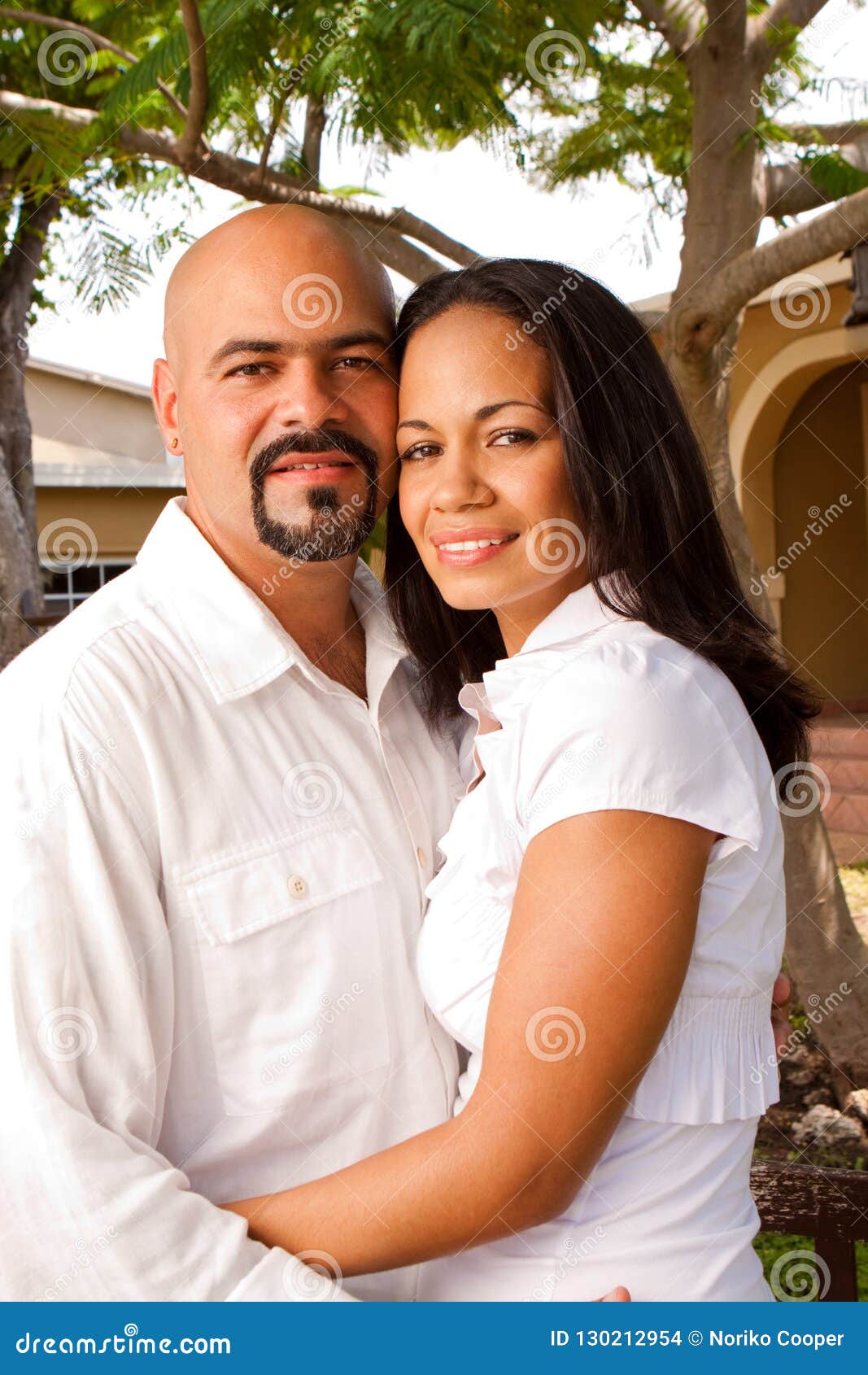 Happy Hispanic Couple Laughing and Smiling Outside. Stock Photo - Image ...