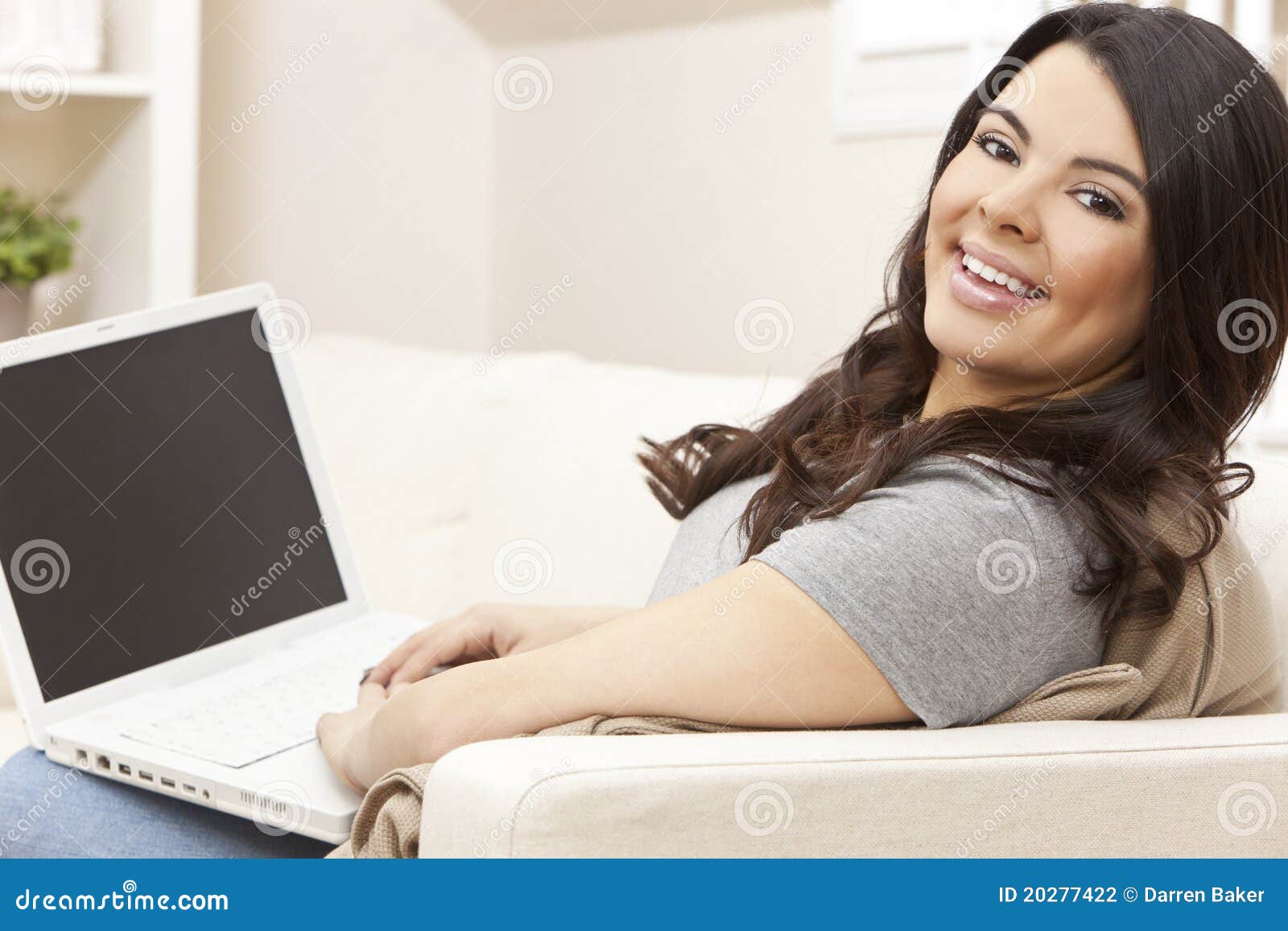 Happy Hispanic Woman Using Laptop Computer at Home Stock Photo - Image ...