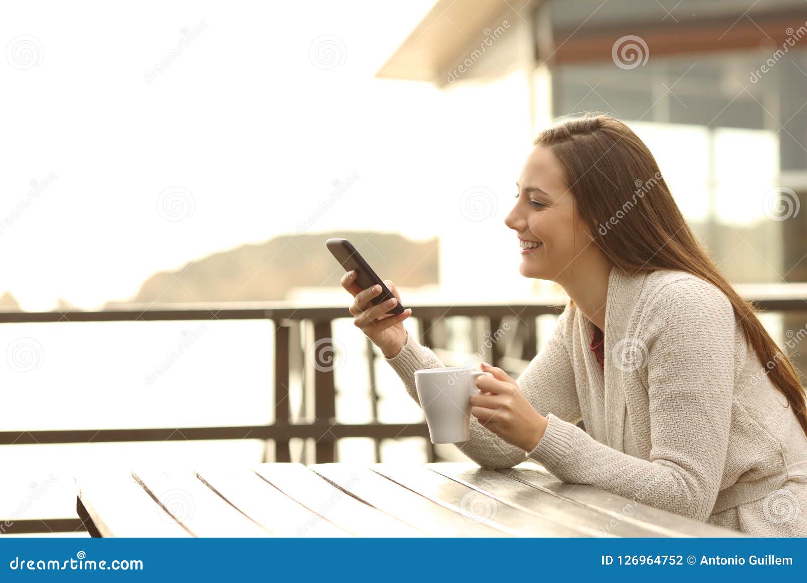 Happy Hotel Guest Using a Smart Phone Outdoors Stock Photo - Image of ...