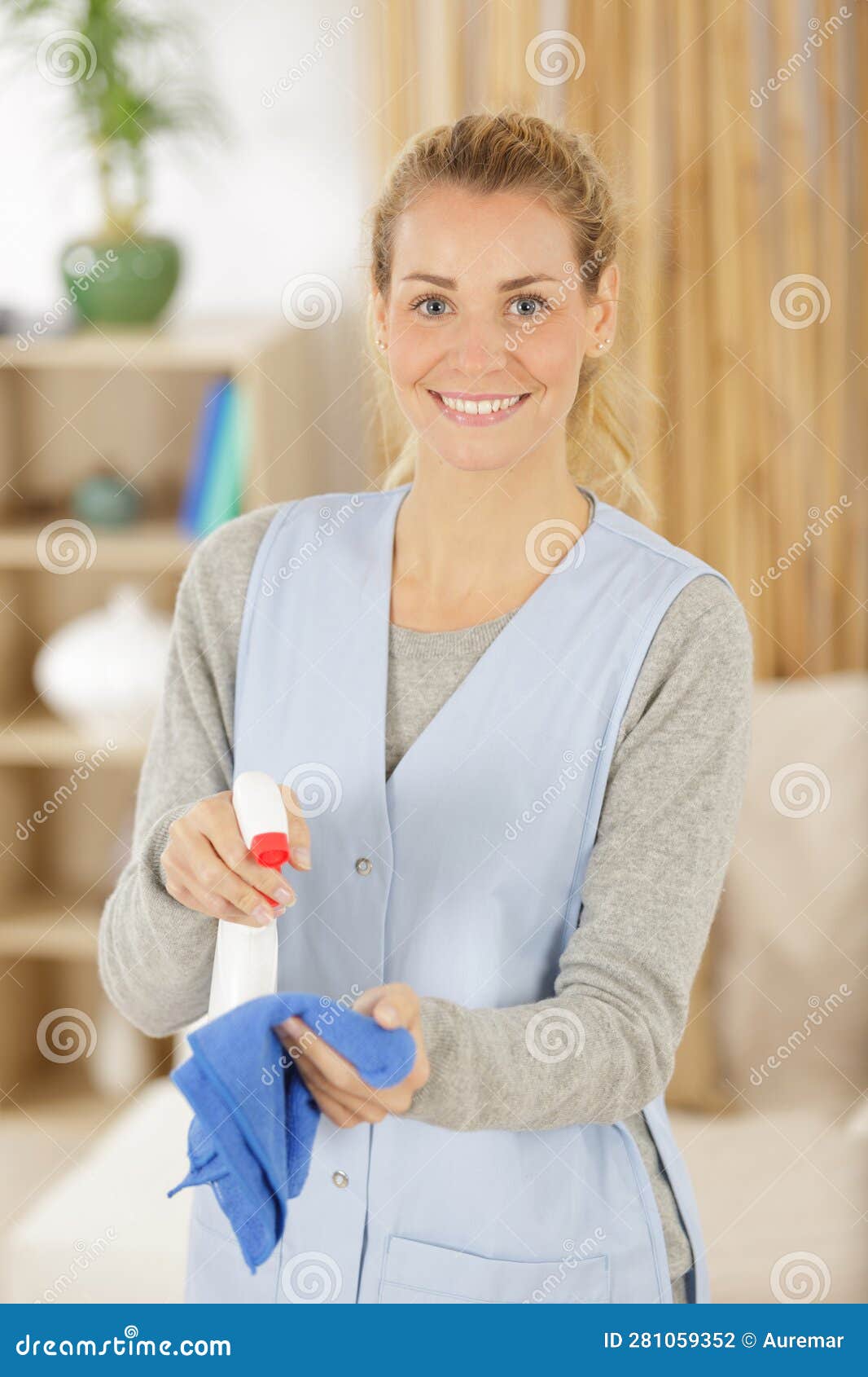 Housekeeper Using Mobile To Control Black Robotic Vacuum Cleaner ...