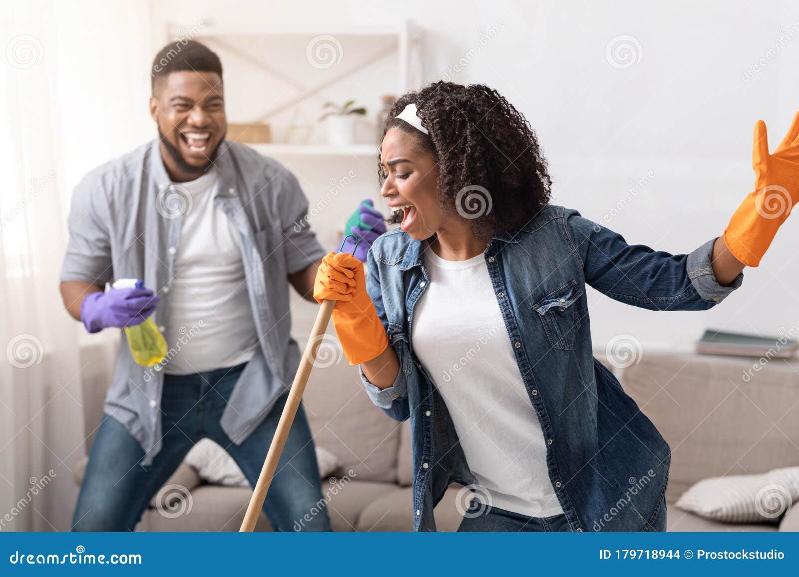 Happy Housekeeping. Cheerful African Couple Having Fun while Cleaning ... Happy Housekeeping. Cheerful African Couple Having Fun while Cleaning ...