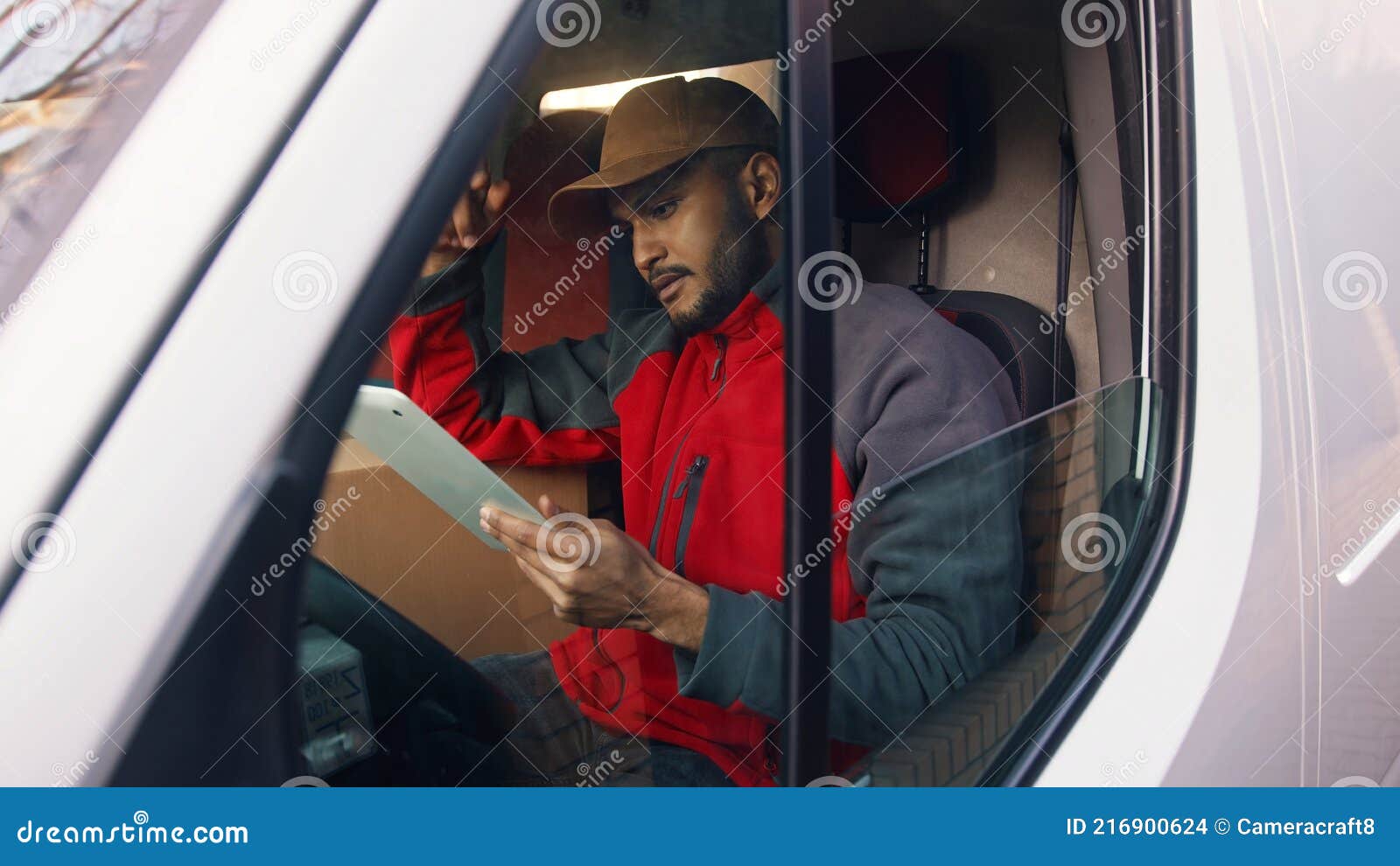Happy Indian Courier Using Tablet in the Van Stock Photo - Image of ...