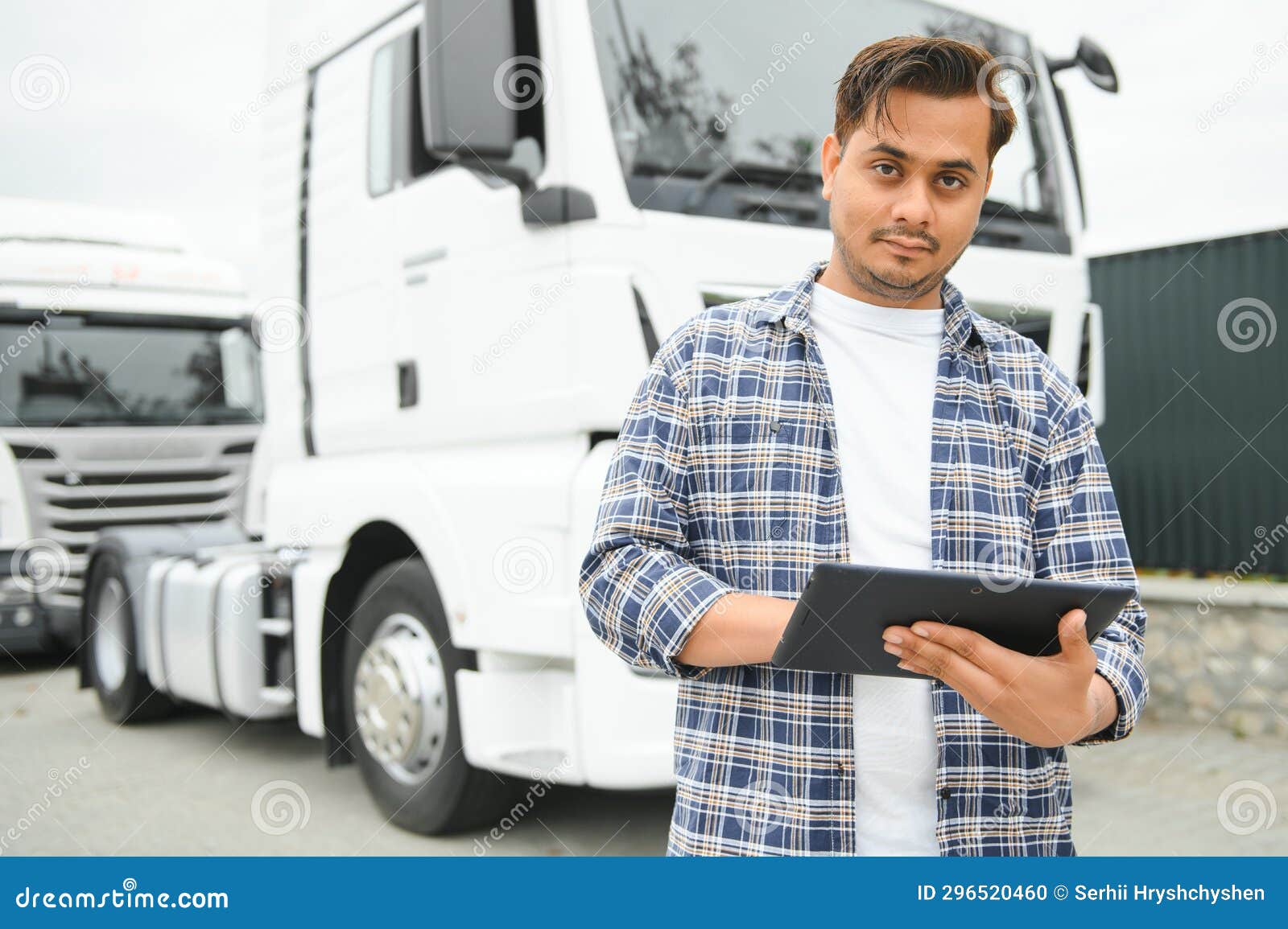 Happy Indian Courier Using Tablet in the Van . High Quality Photo Stock ...