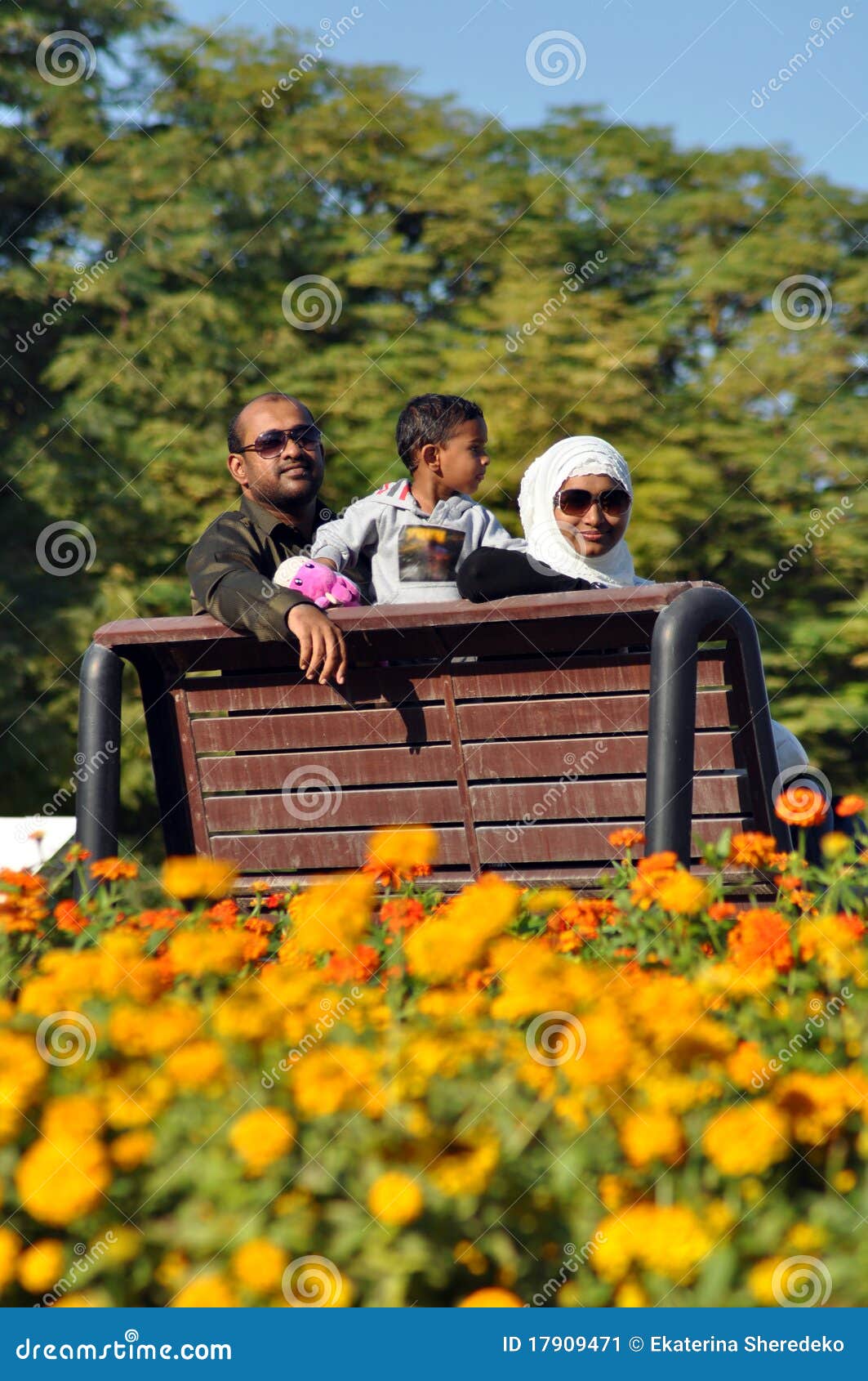 Happy Indian Family Sitting on Bench Stock Image - Image of family ...
