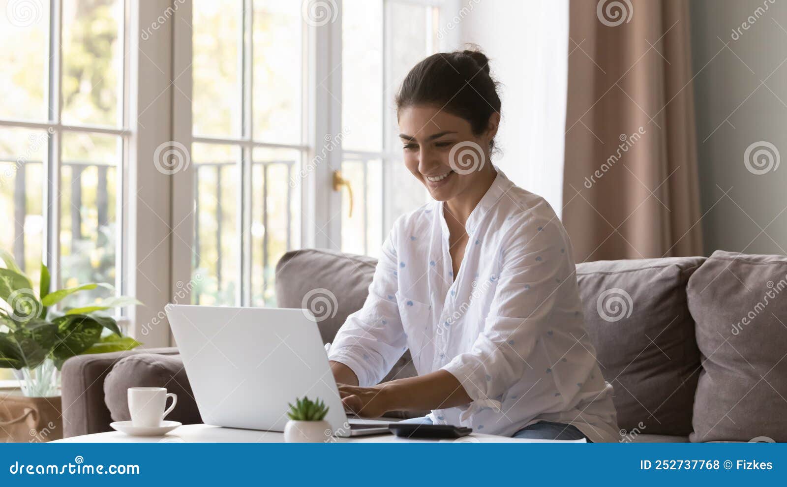 Happy Indian Freelancer Woman Working From Home Using Laptop Stock