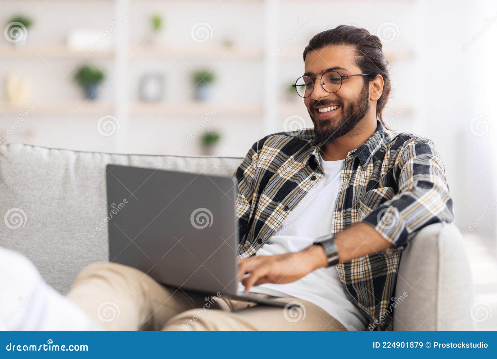 Happy Indian Guy Working from Home, Using Notebook Stock Image - Image ...