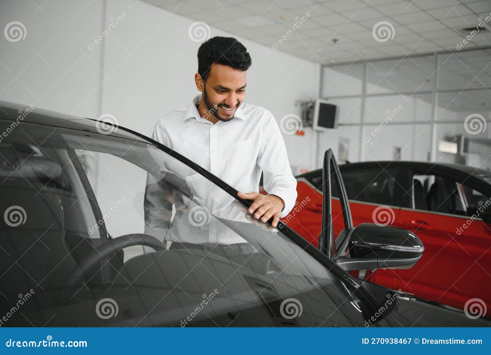 Happy Indian Man Checking Car Features at Showroom Stock Image - Image ...