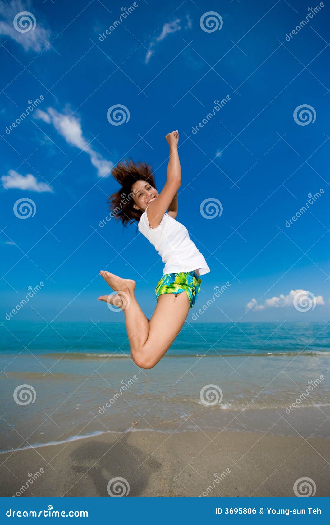 Happy jump at the beach stock photo. Image of healthy - 3695806