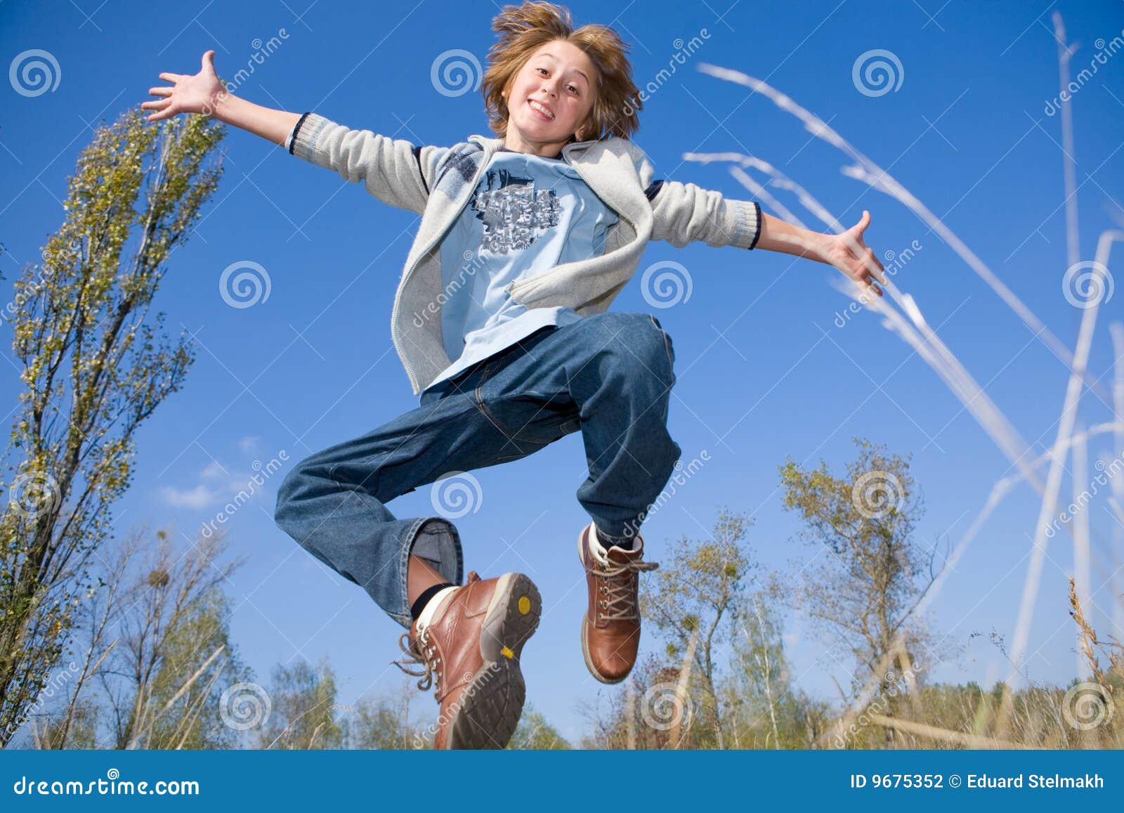 Happy jumping boy stock photo. Image of action, lively - 9675352