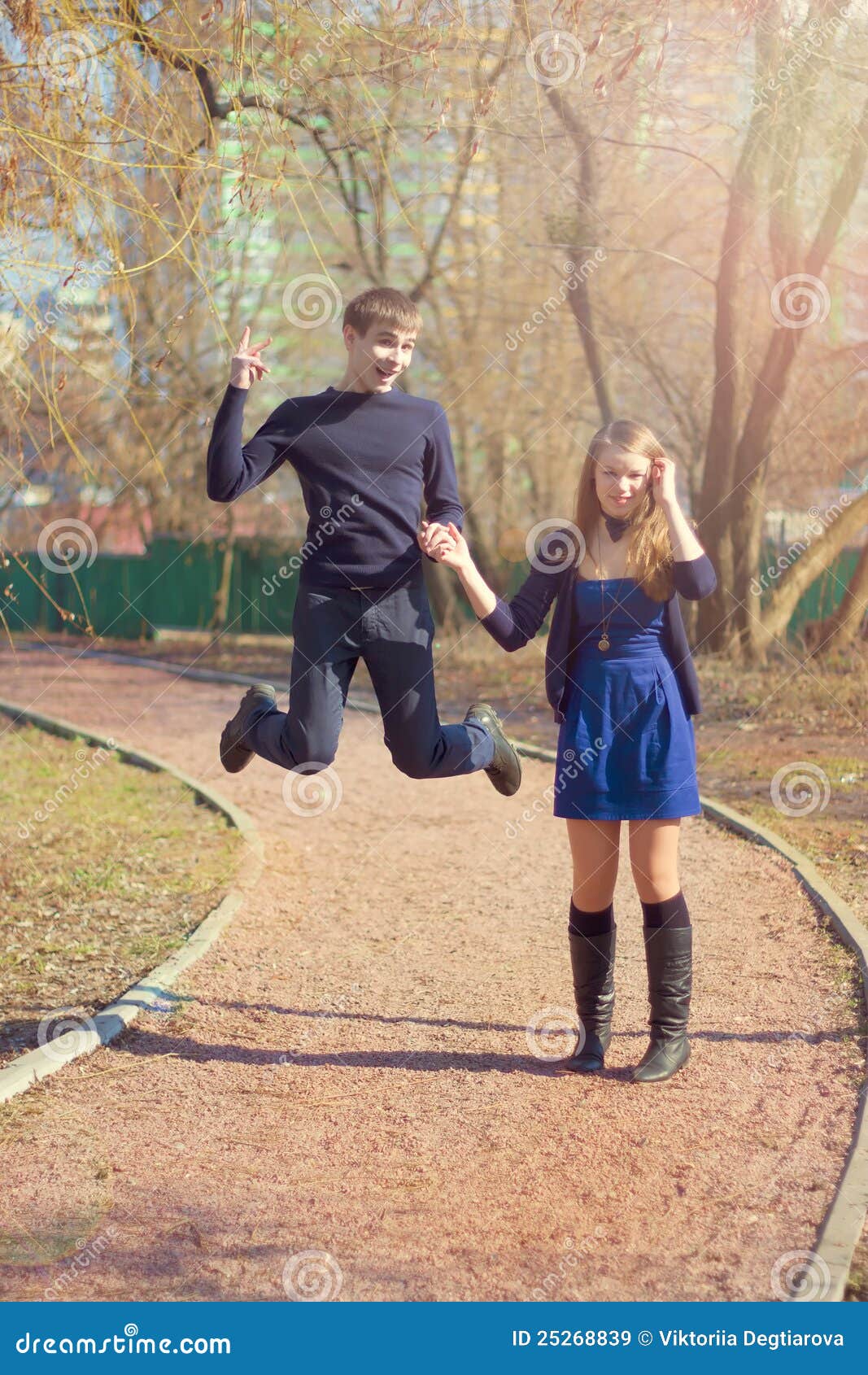 Happy jumping pair stock image. Image of green, flying - 25268839