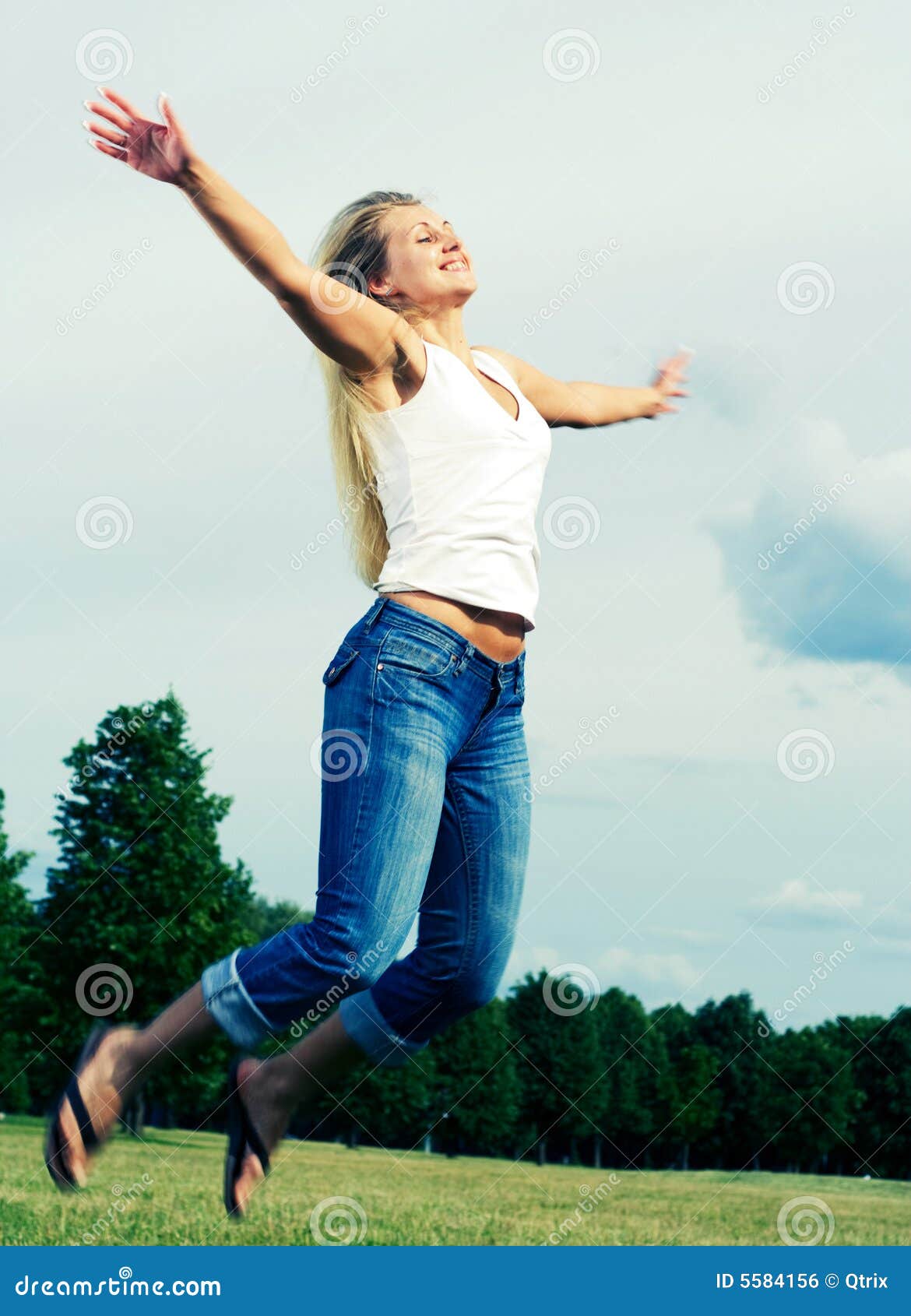 Happy jumping woman. stock photo. Image of exercising - 5584156