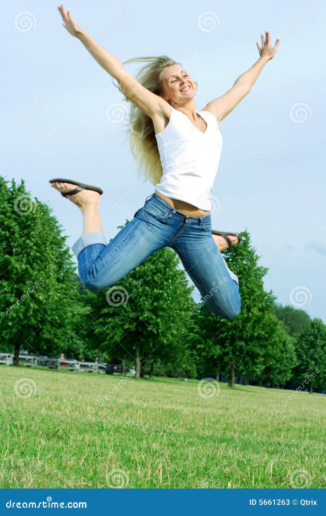 Happy jumping woman. stock image. Image of motion, park - 5661263