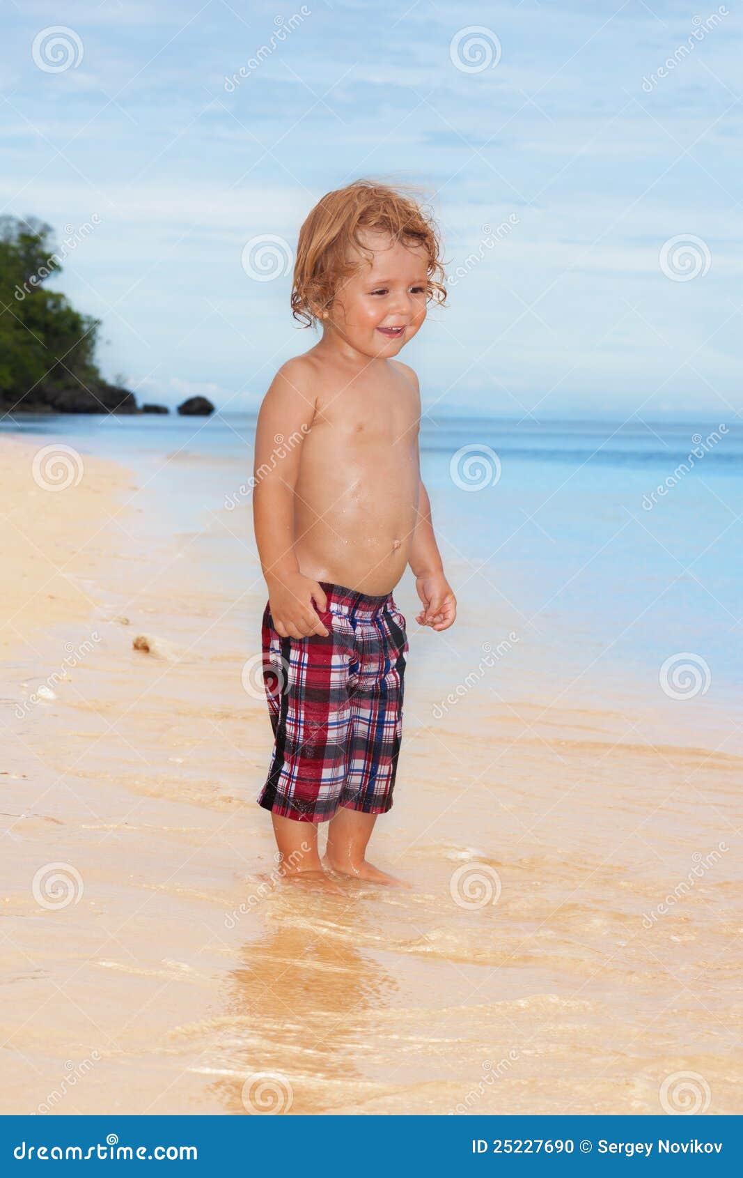 Happy kid on the beach stock photo. Image of baby, child - 25227690