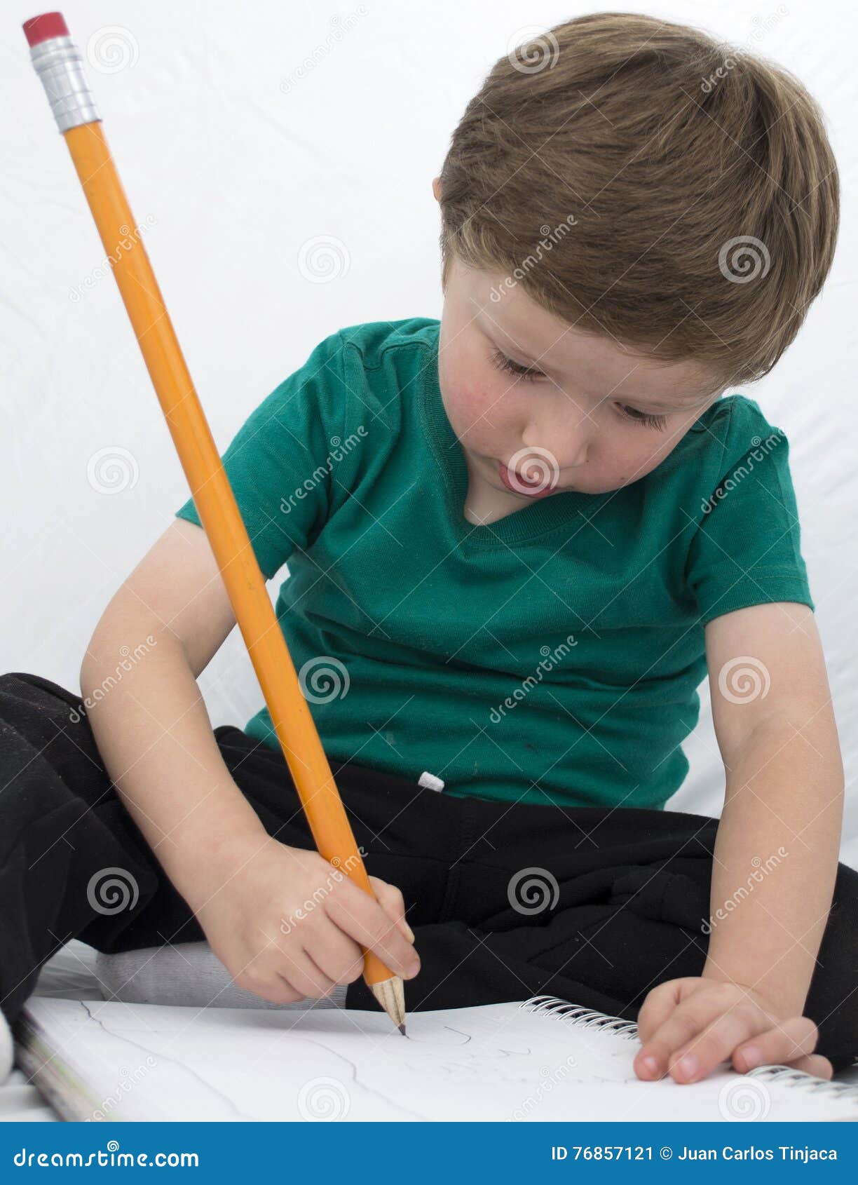 Happy kid coloring a book. stock image. Image of learn - 76857121