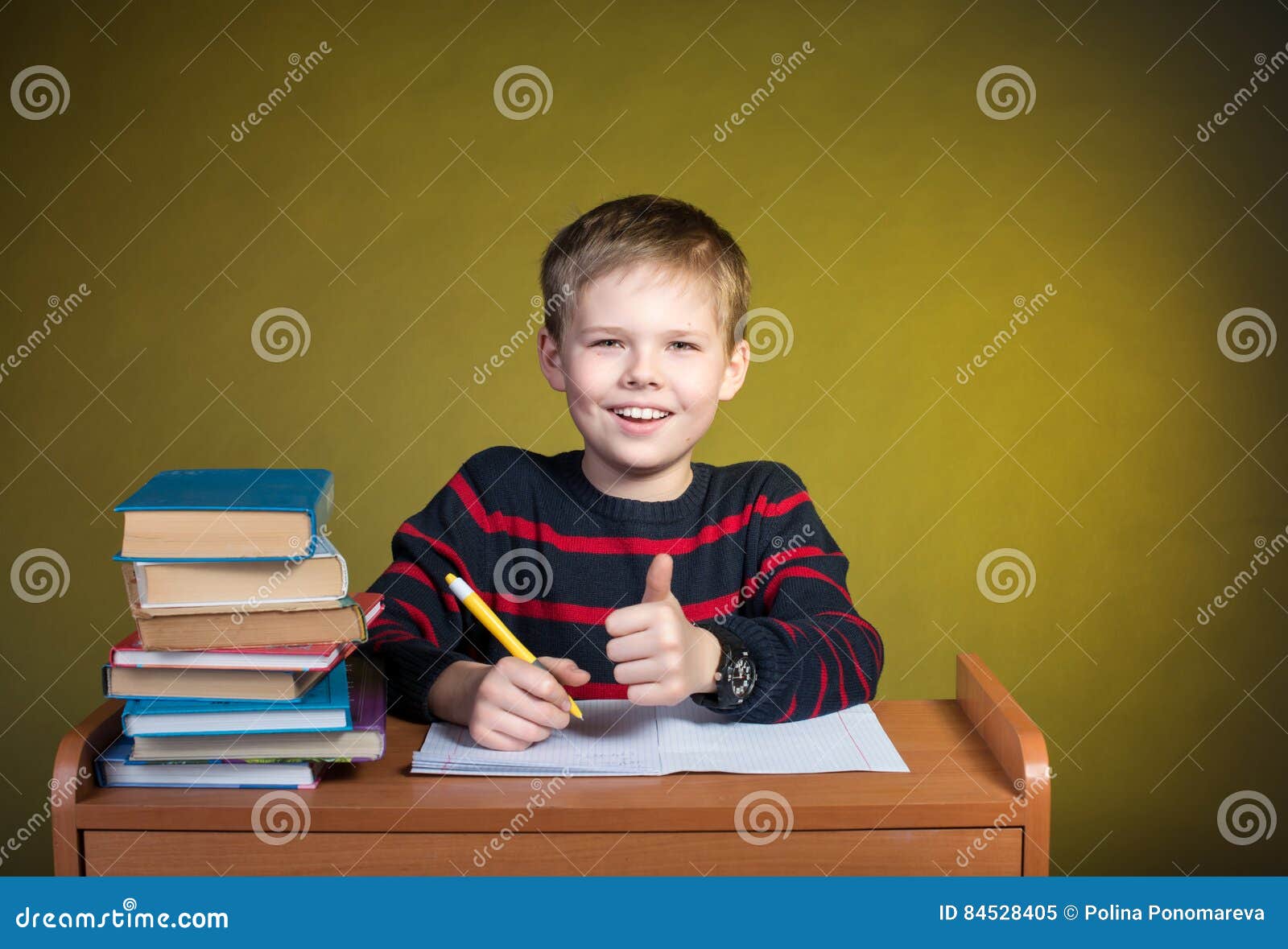 Happy Kid Doing Homework with Thumb Up, Books on Table. Stock Image ...