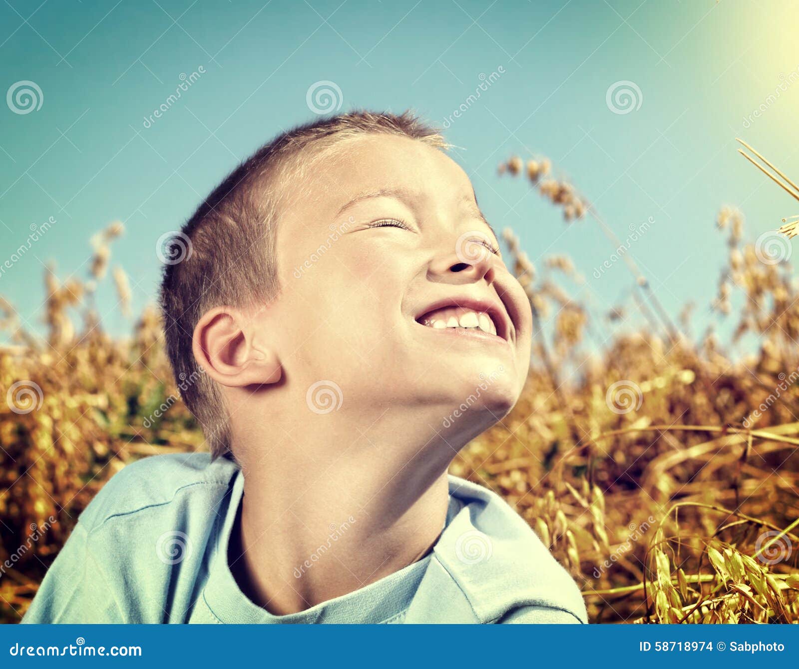 Happy Kid in the Field stock photo. Image of happy, positivity - 58718974