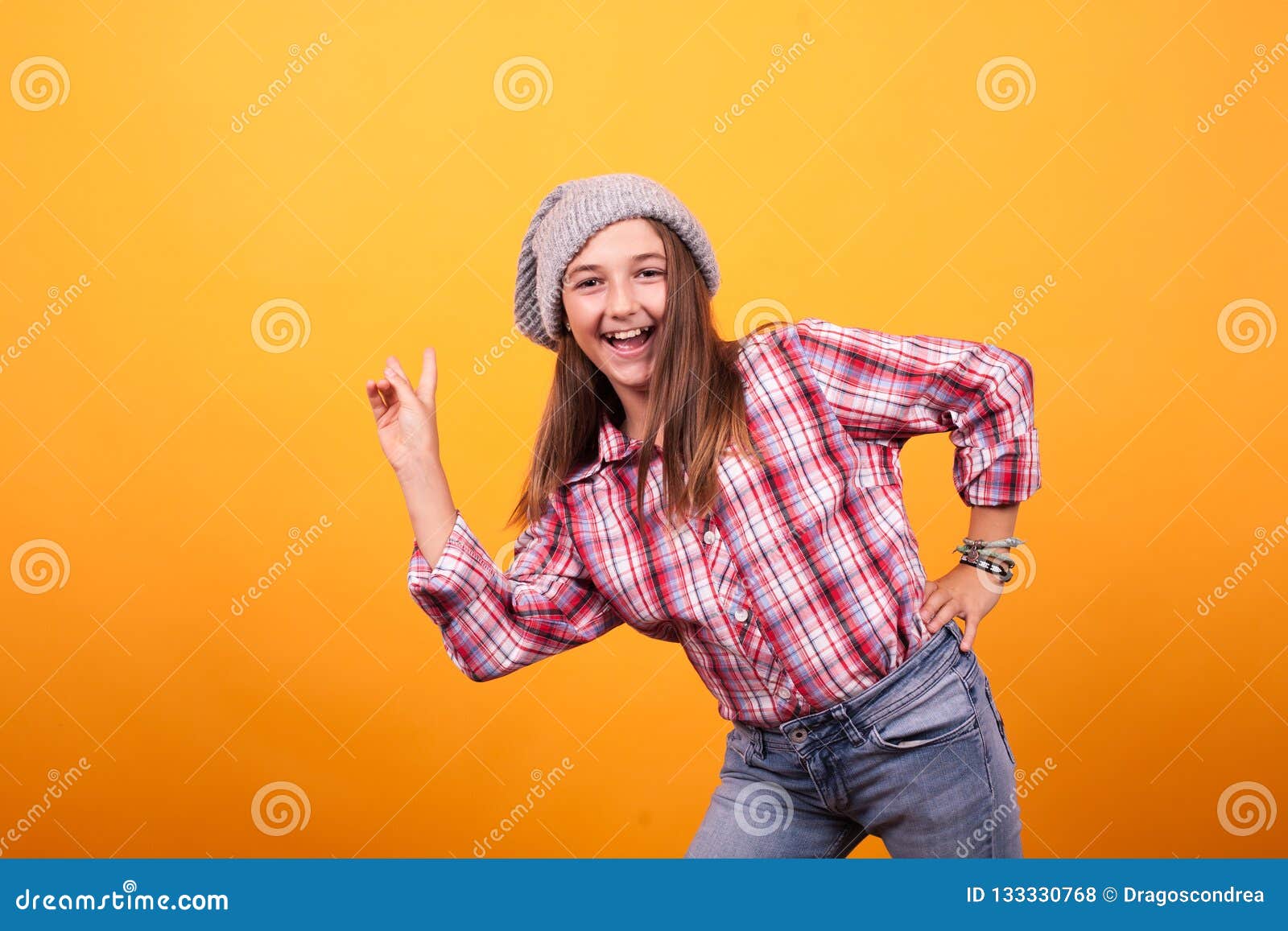 Happy Kid Fooling Around in Studio on Yellow Background Stock Photo ...