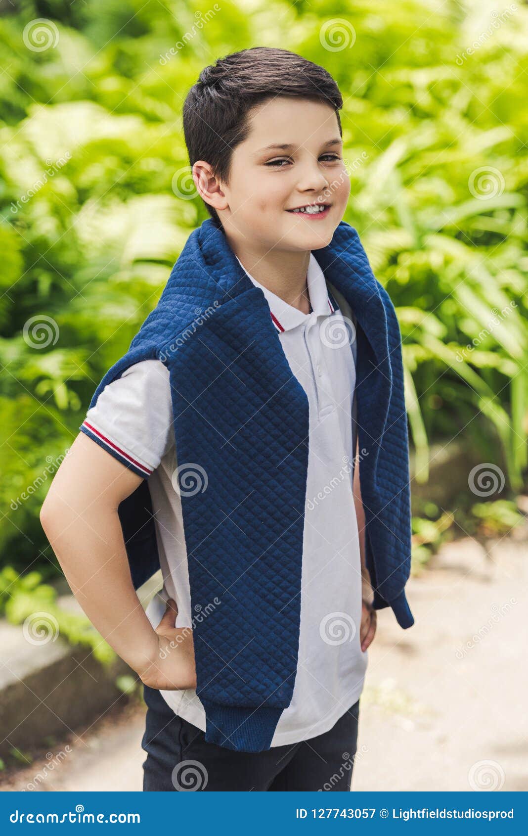 Happy Kid with Jumper Over Shoulders Looking Stock Image - Image of ...