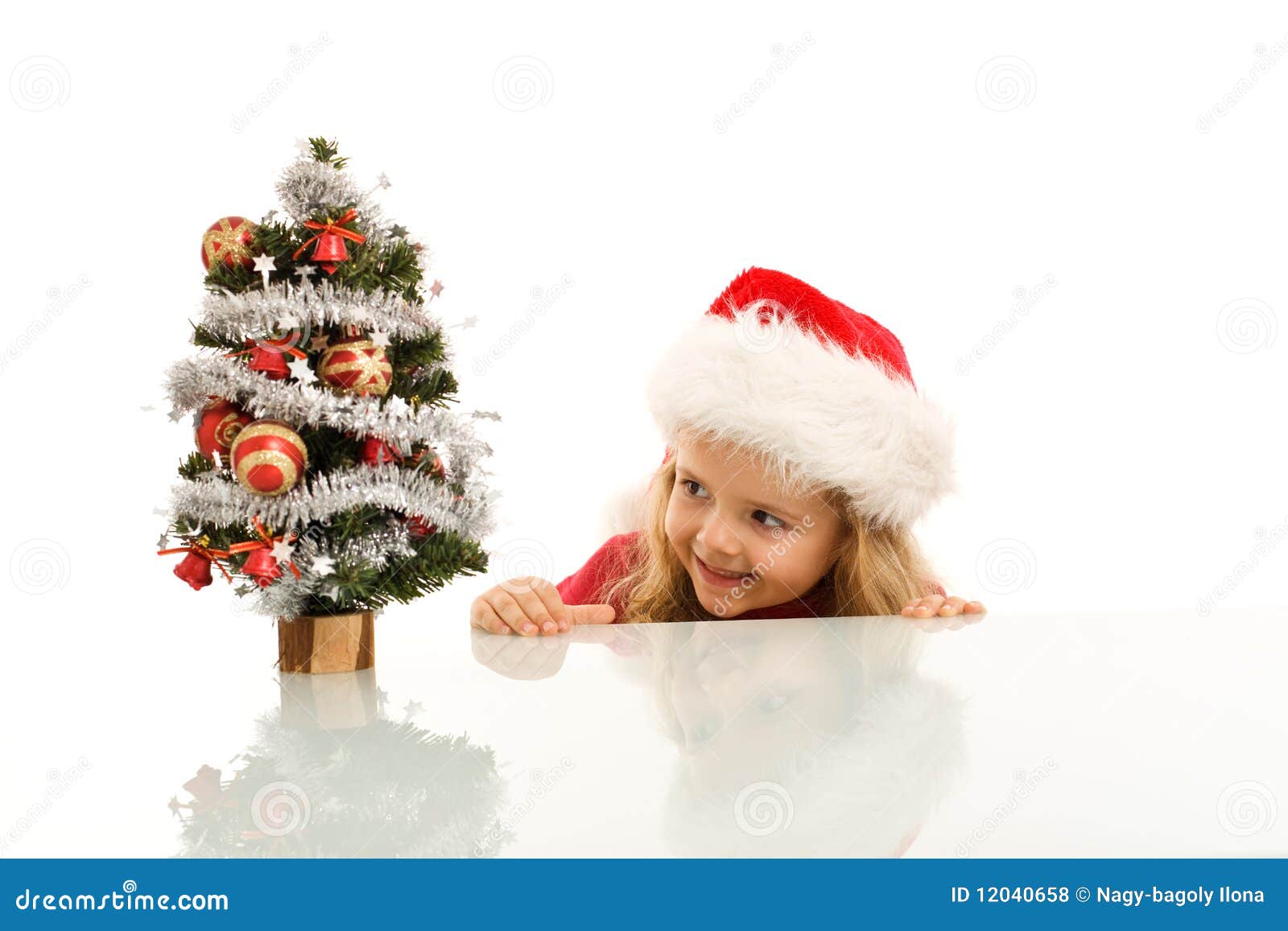 Happy Kid Lurking Around a Small Christmas Tree Stock Photo - Image of ...