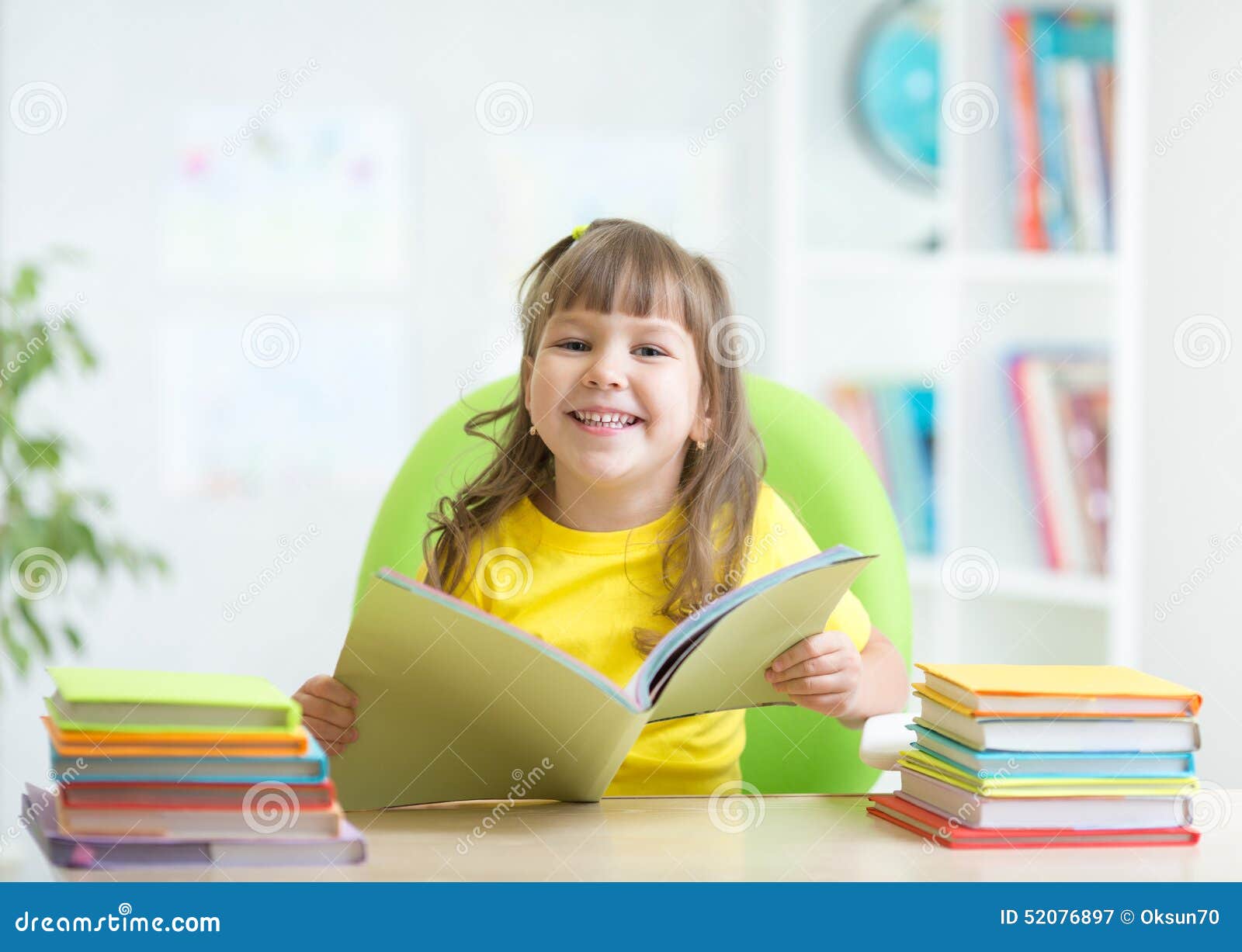 Happy kid with opened book stock image. Image of knowledge - 52076897