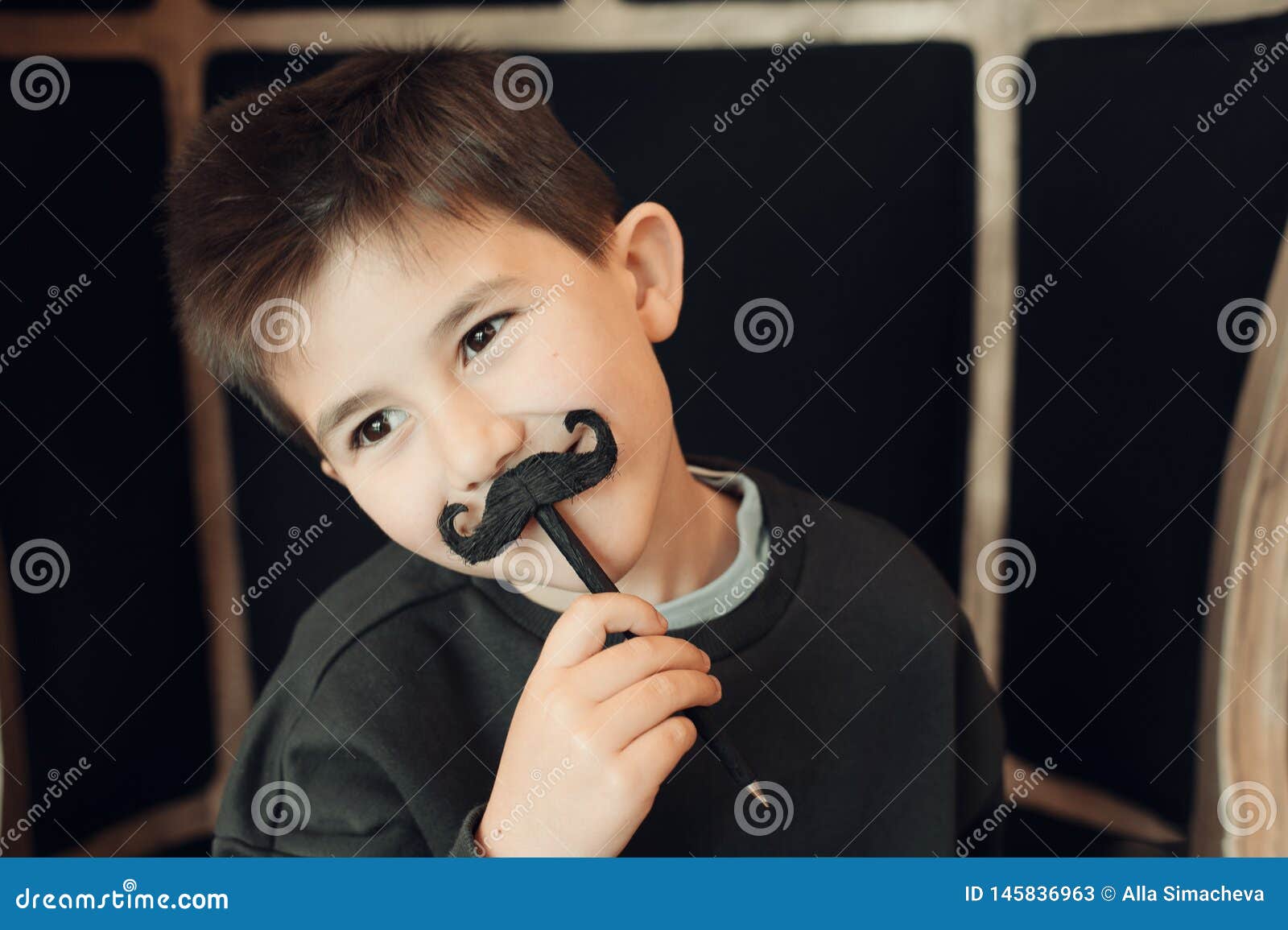 Happy Kid Posing with a Fake Moustache on Black Background Stock Image ...