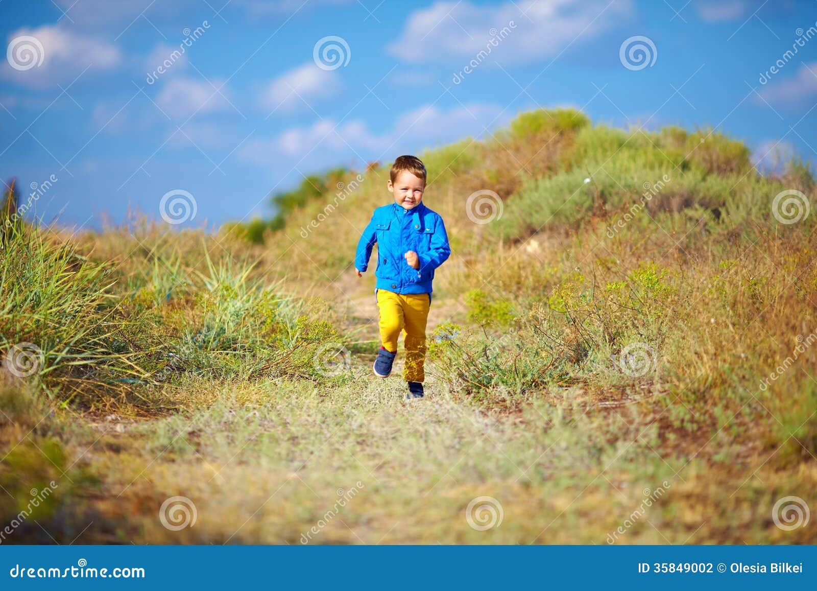 Happy Kid Running the Summer Field Stock Photo - Image of jacket ...
