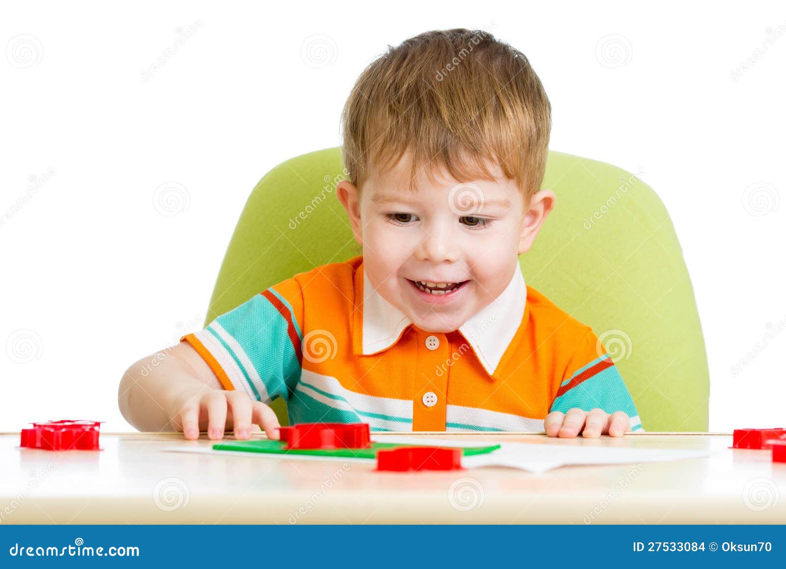 Happy Kid Sitting at Table and Playing Stock Photo - Image of handcraft ...