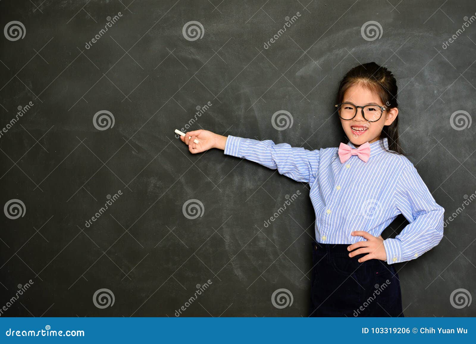 Happy Kid Tutor Using Chalk Pointing Empty Area Stock Photo - Image of ...