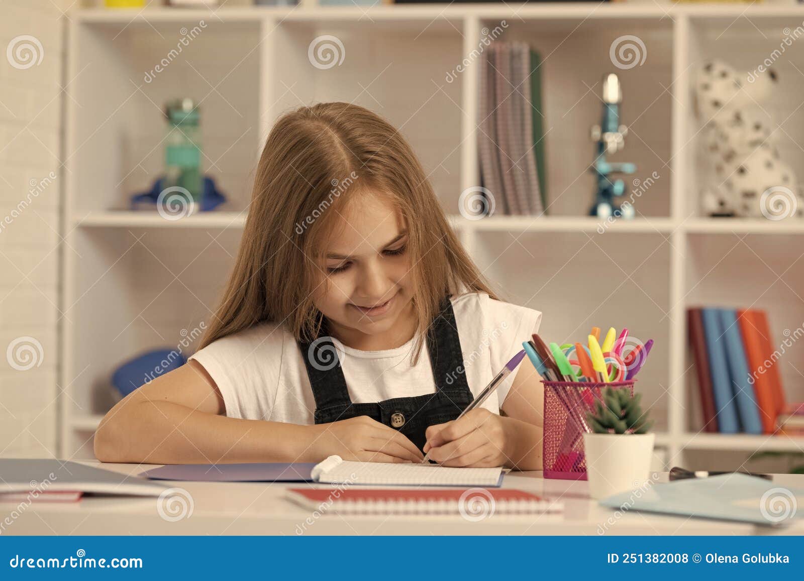 Happy Kid Write in Workbook at School Lesson in Classroom Wear Uniform ...
