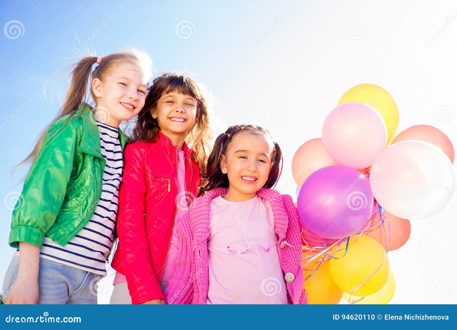 Happy kids with balloons stock photo. Image of future - 94620110