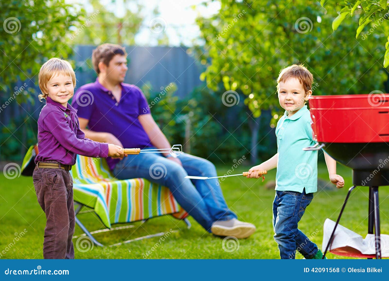 Happy Kids Fighting with Kitchen Items on Picnic Stock Photo - Image of ...