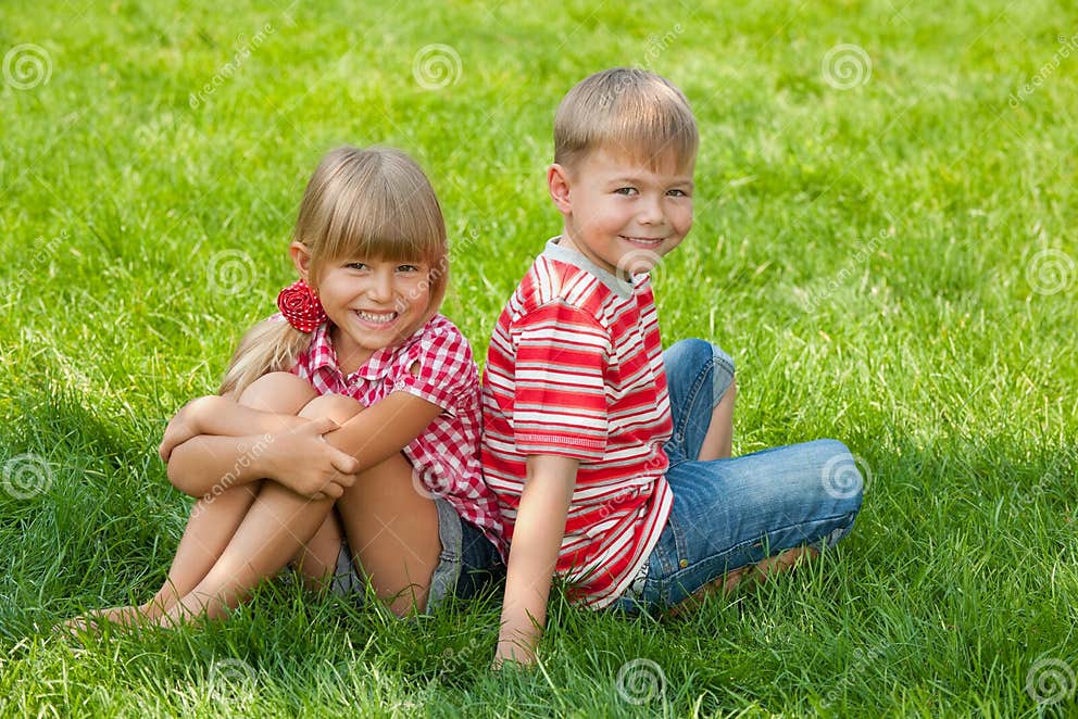 Happy kids on the grass stock image. Image of caucasian - 26320233