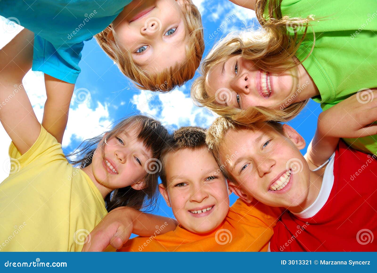 Happy Kids in a Huddle stock image. Image of colorful - 3013321