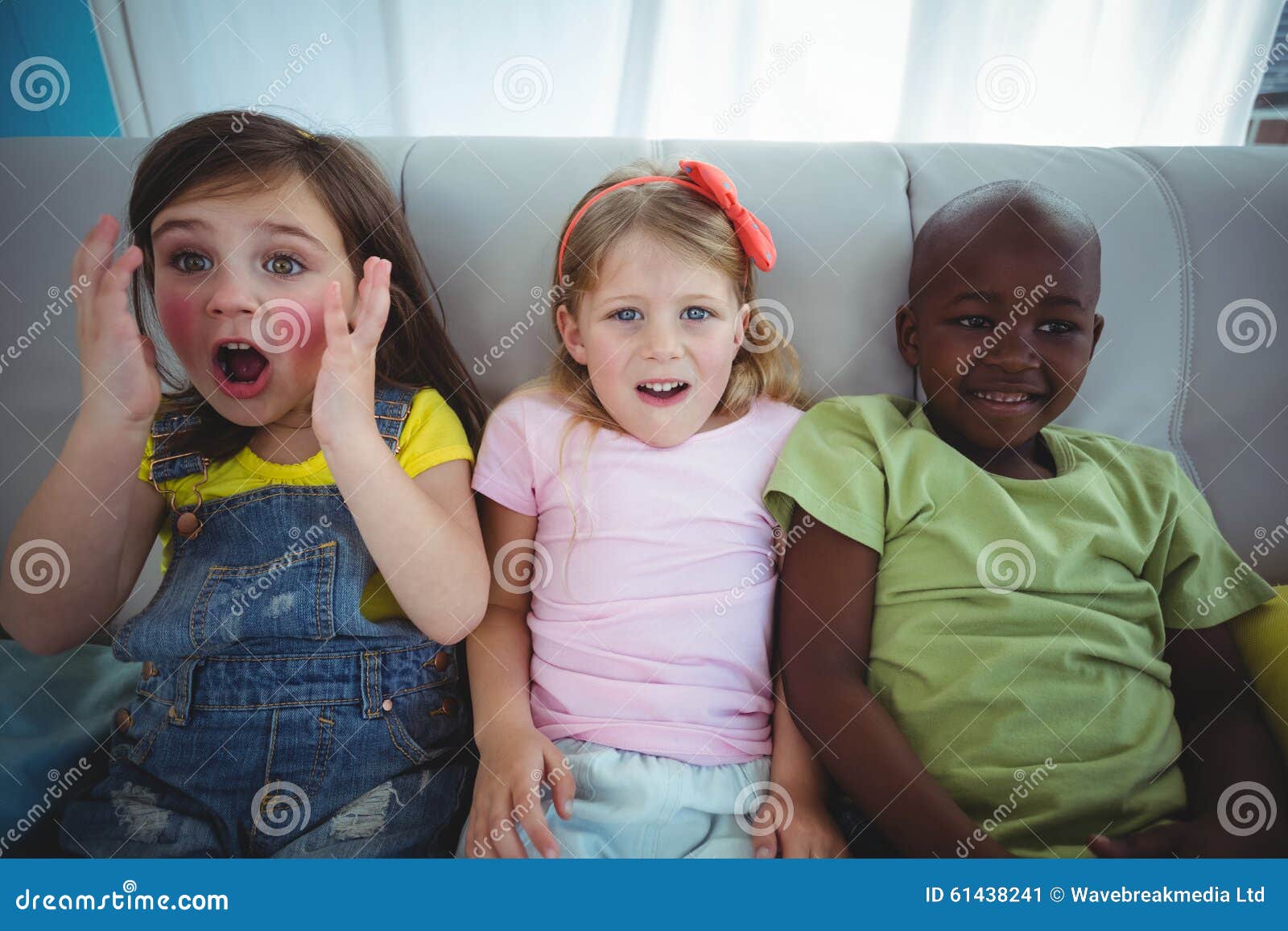 Happy Kids Laughing while Sitting Down Stock Image - Image of black ...