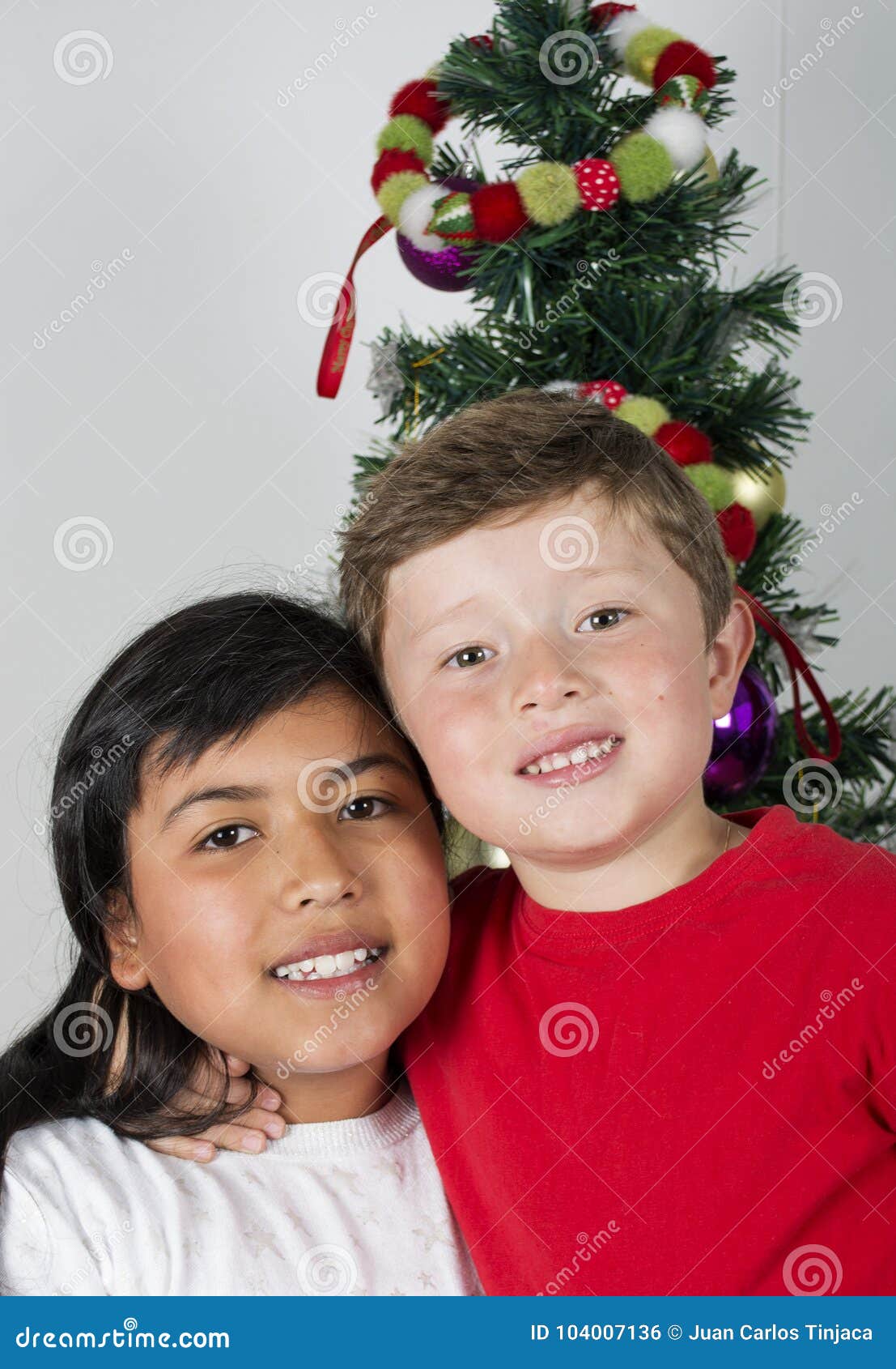 Happy Kids Laying Under the Christmas Tree. Stock Photo - Image of face ...
