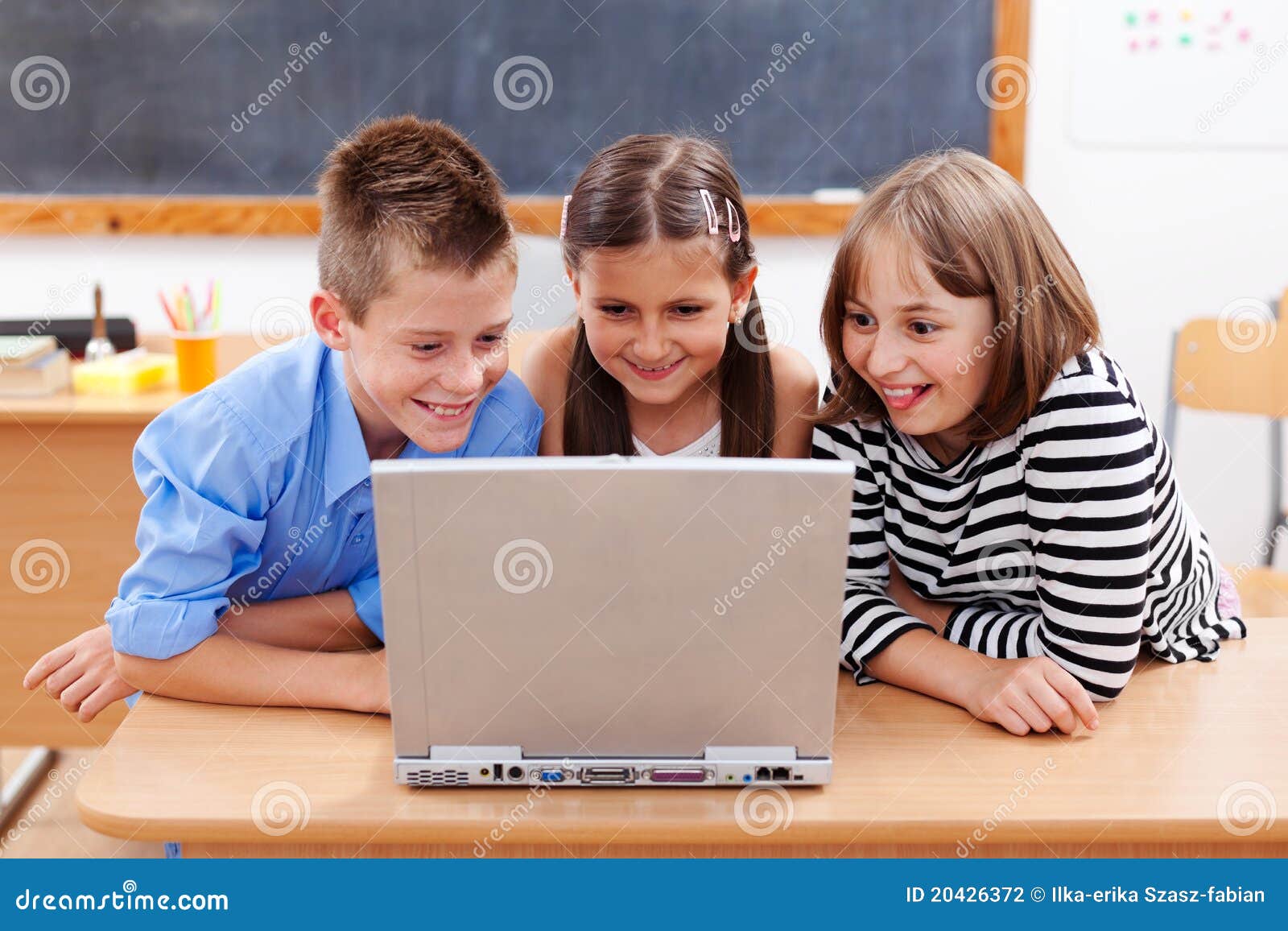 Happy Kids Looking at Laptop Stock Photo - Image of room, watch: 20426372