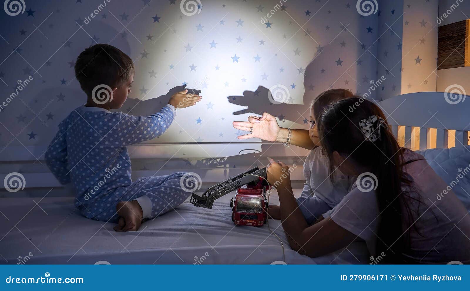 Happy Kids with Mother Playing with Flashlight in Shadow Theater at ...