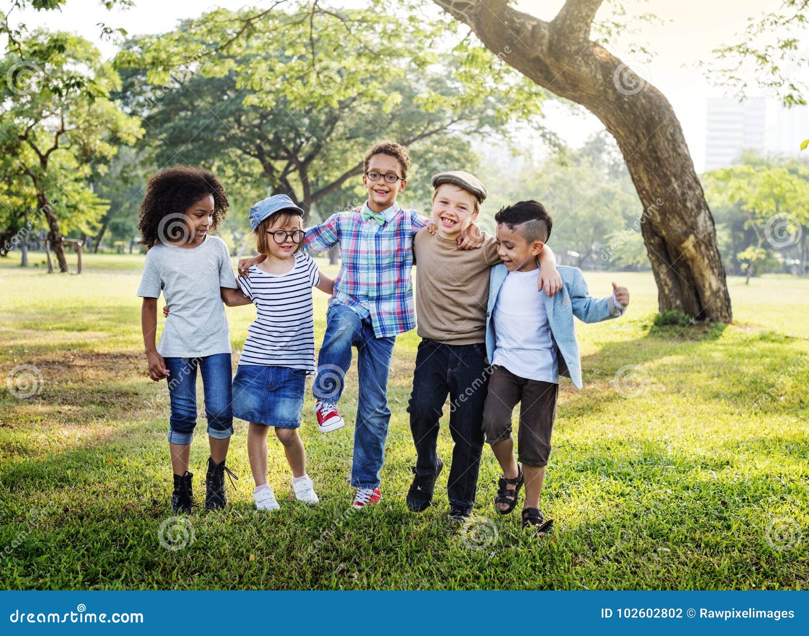 Happy kids in the park stock photo. Image of friends - 102602802