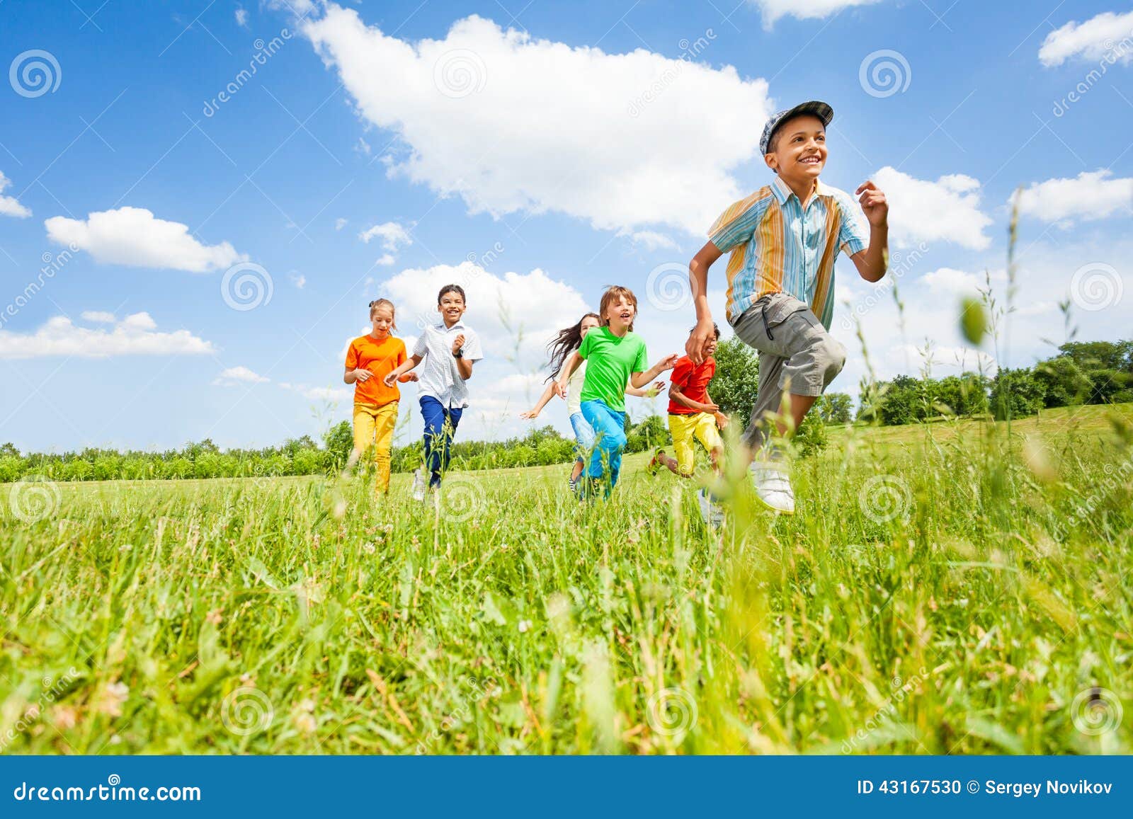 Happy Kids Playing and Running in the Field Stock Photo - Image of ...