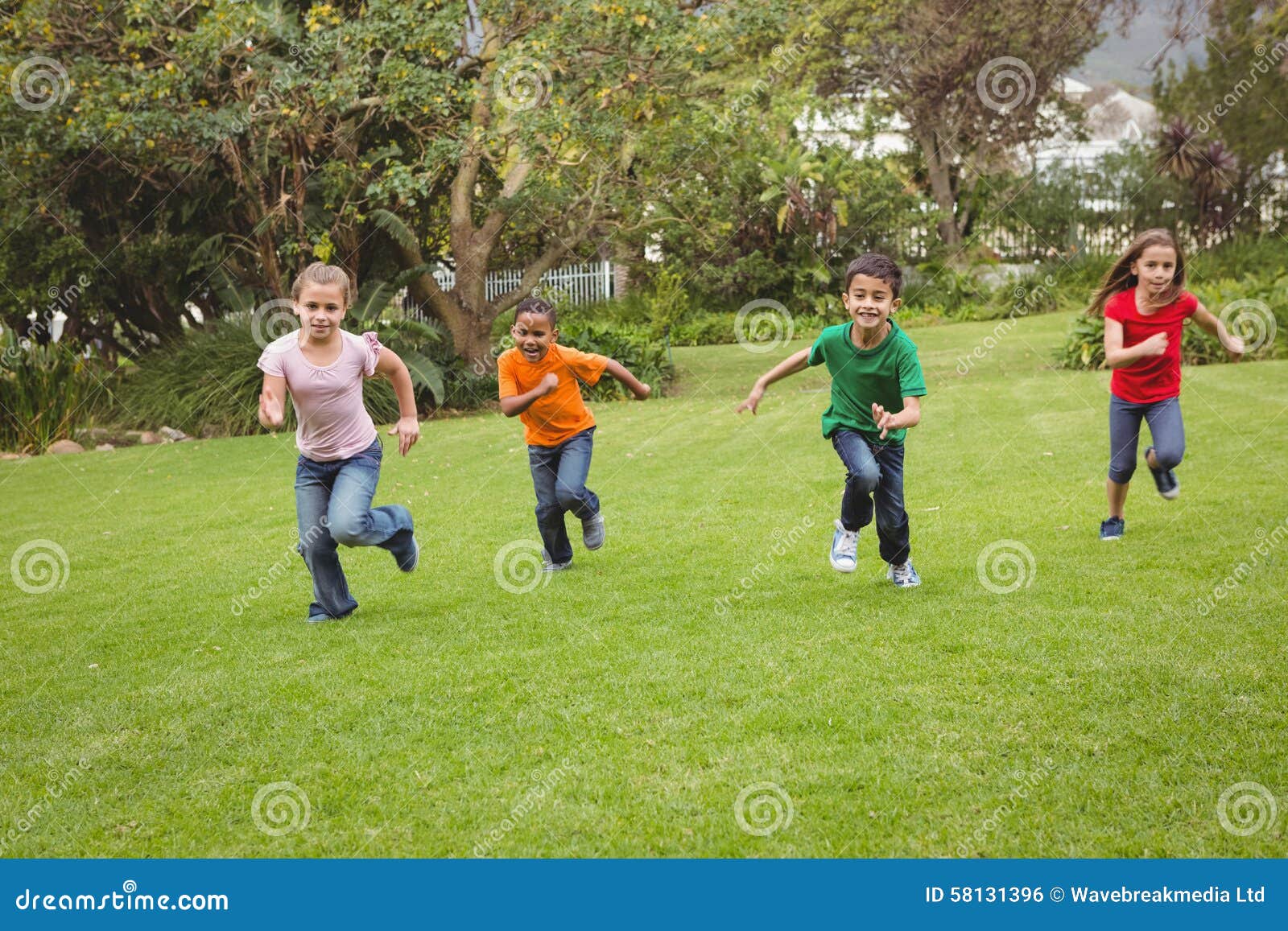 Happy Kids Running Across the Grass Stock Photo - Image of girl, female ...