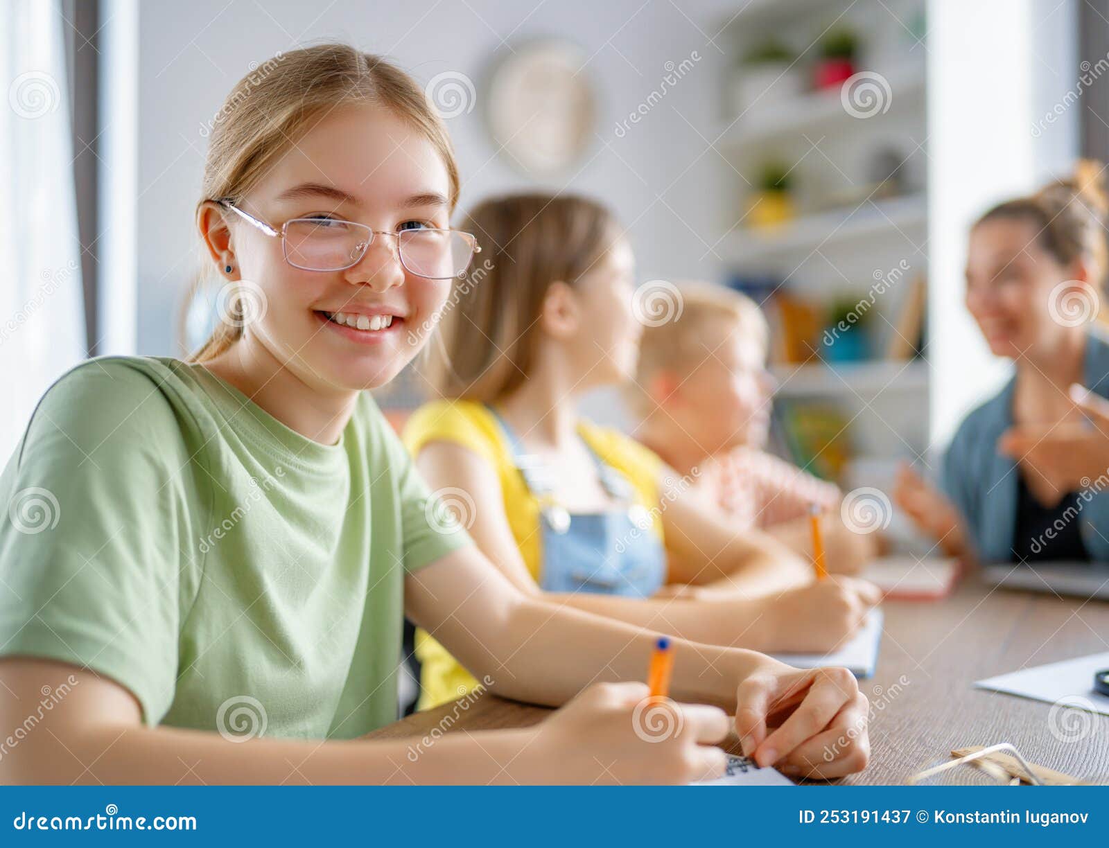 Happy kids at school stock image. Image of person, adult - 253191437